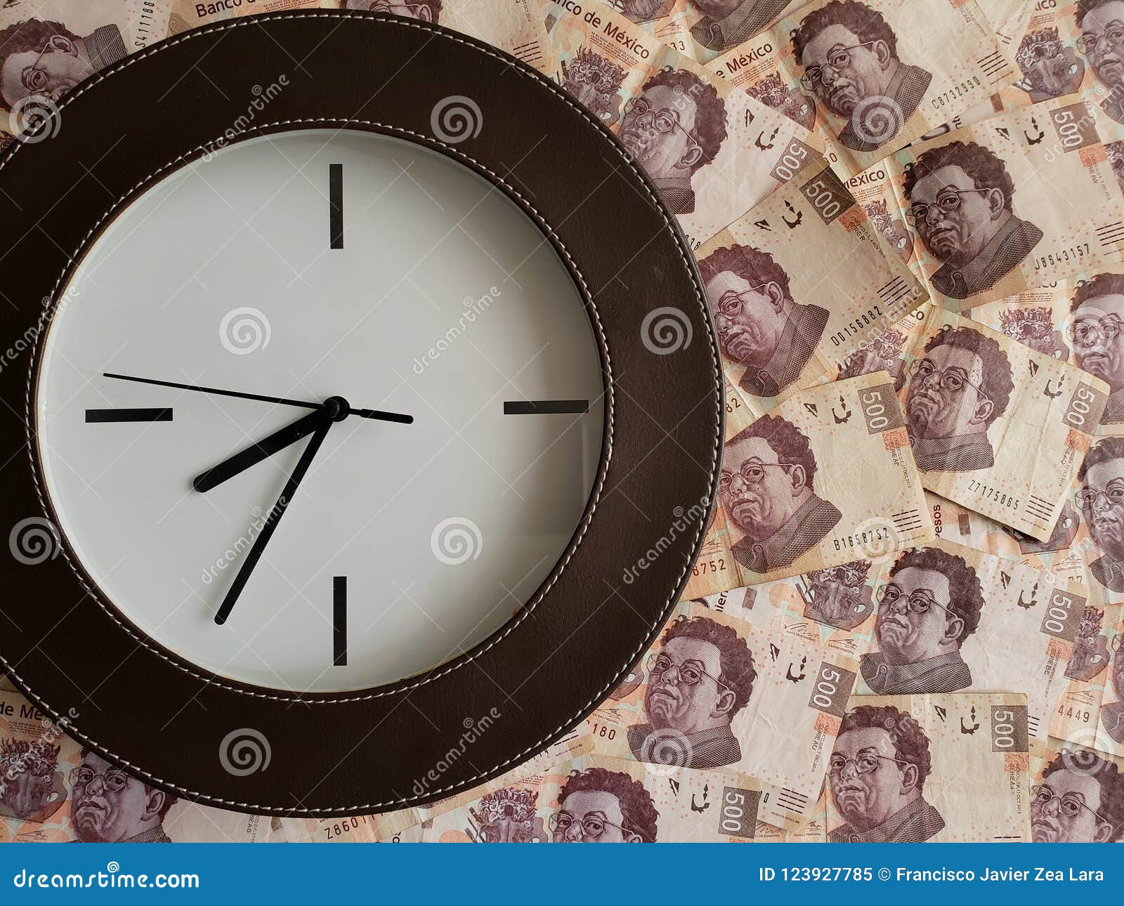 Circular Clock without Numbers and Background with Mexican Banknotes of ...