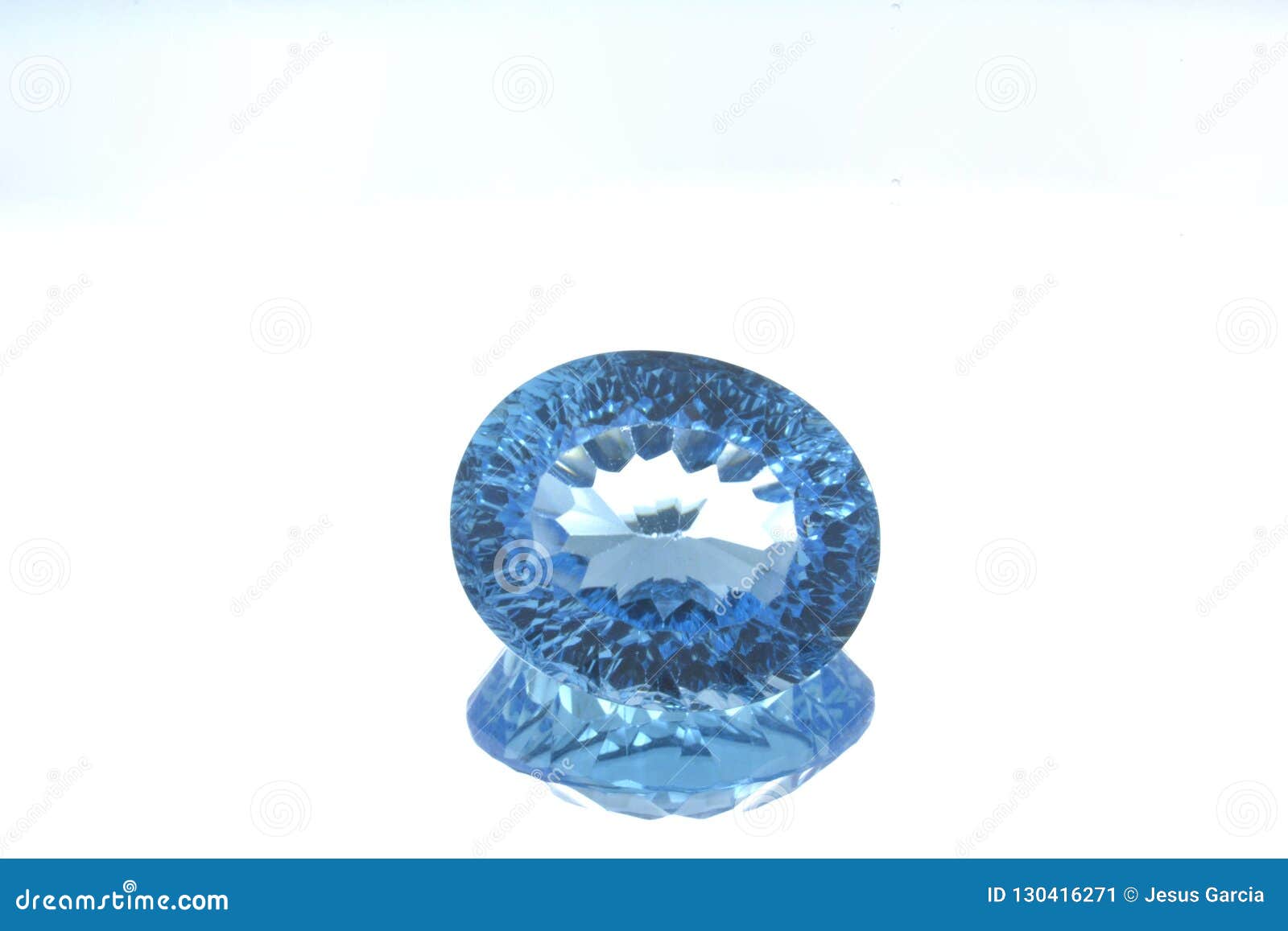 Circular Gem of Blue Topaz on a Glass Stock Image - Image of glass ...