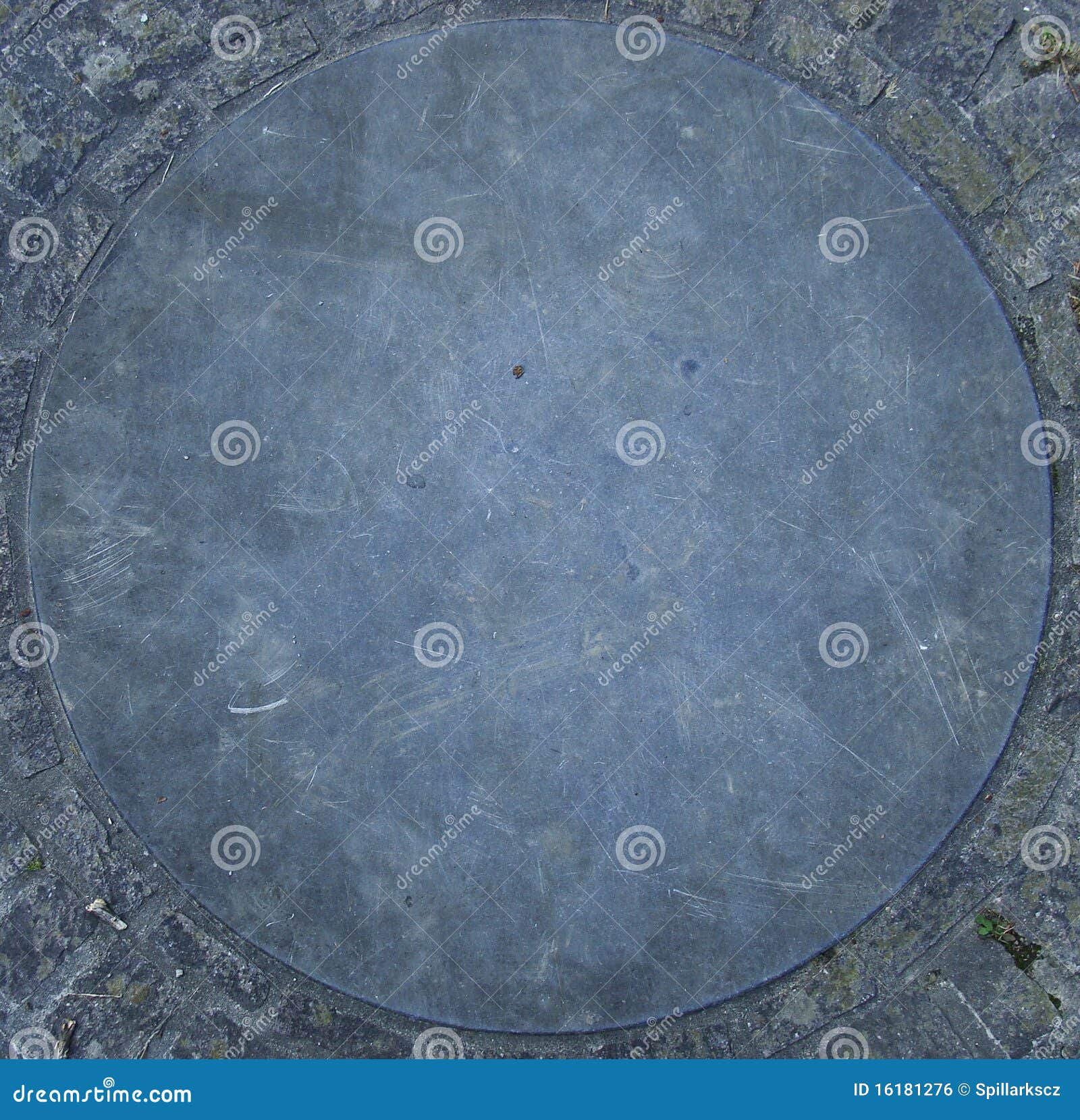 Circular Metal Plate Embedded in Cobble Stone Stock Photo - Image of ...