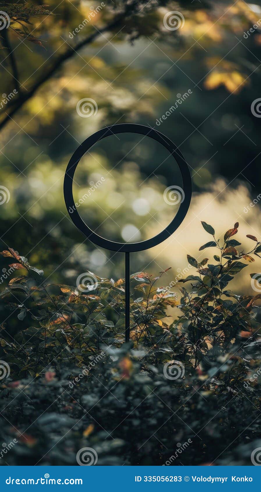 Circular Metal Sculpture in a Lush Garden Setting Stock Image - Image ...