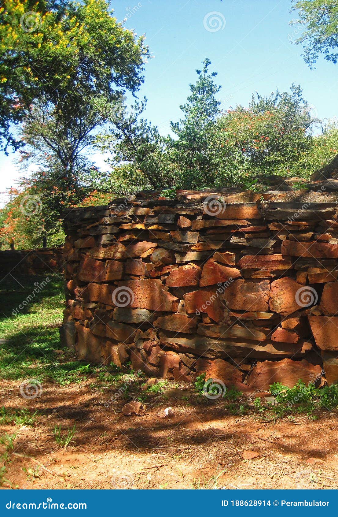 CIRCULAR STONE WALL in the SHADE of TREES Stock Photo - Image of light ...