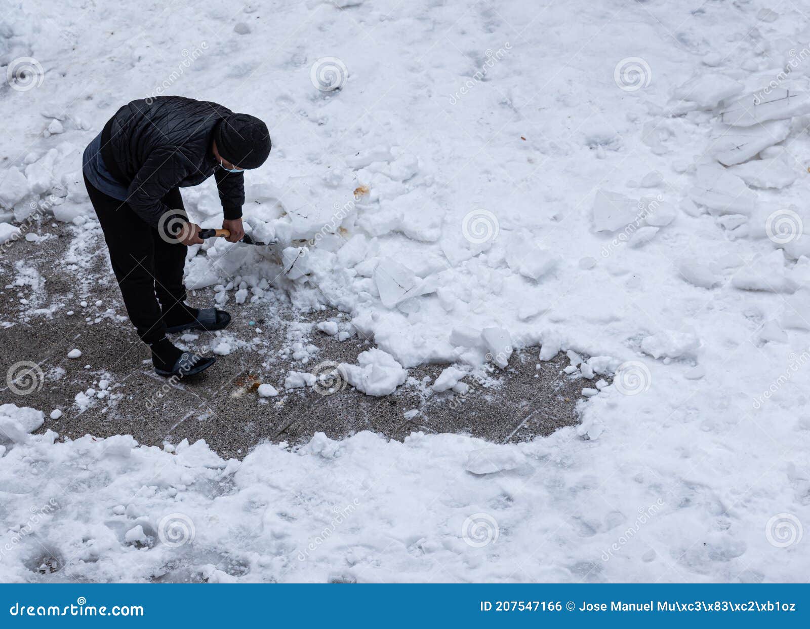 Citizens Shoveling Frozen Snow Due To The Filomena Storm Editorial