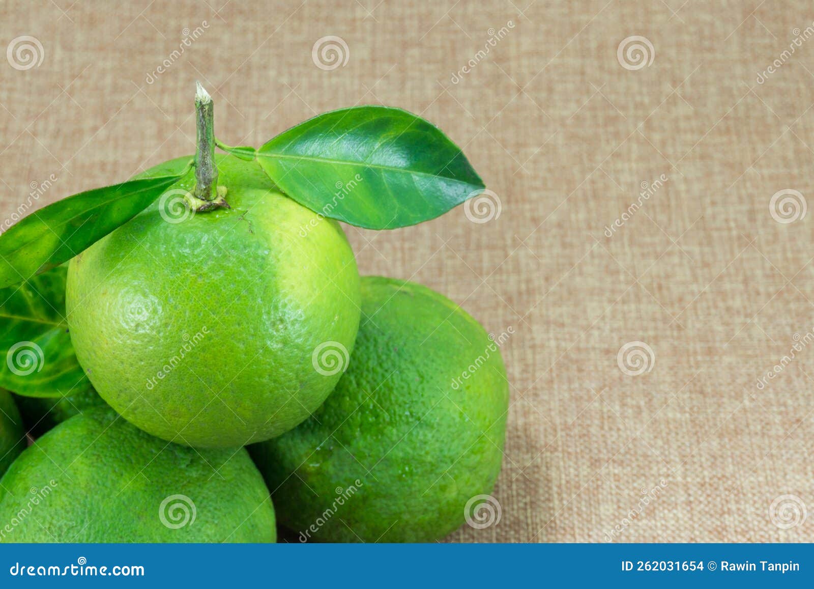 Citrus Fruit, Composition with Leaves on Brown Fabric Background Stock ...