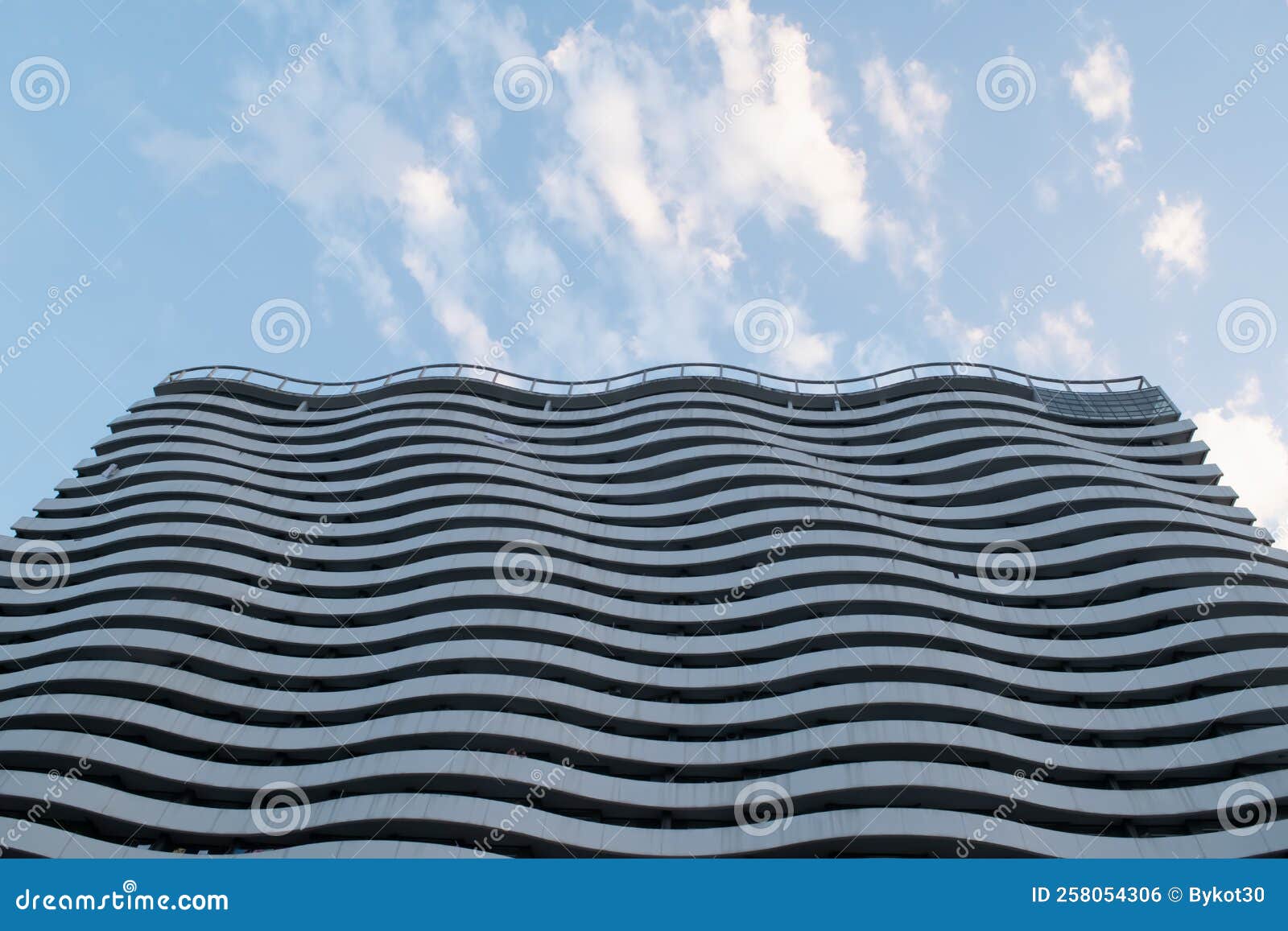 Wavy White Building Against the Sky. Beautiful Modern Architecture ...
