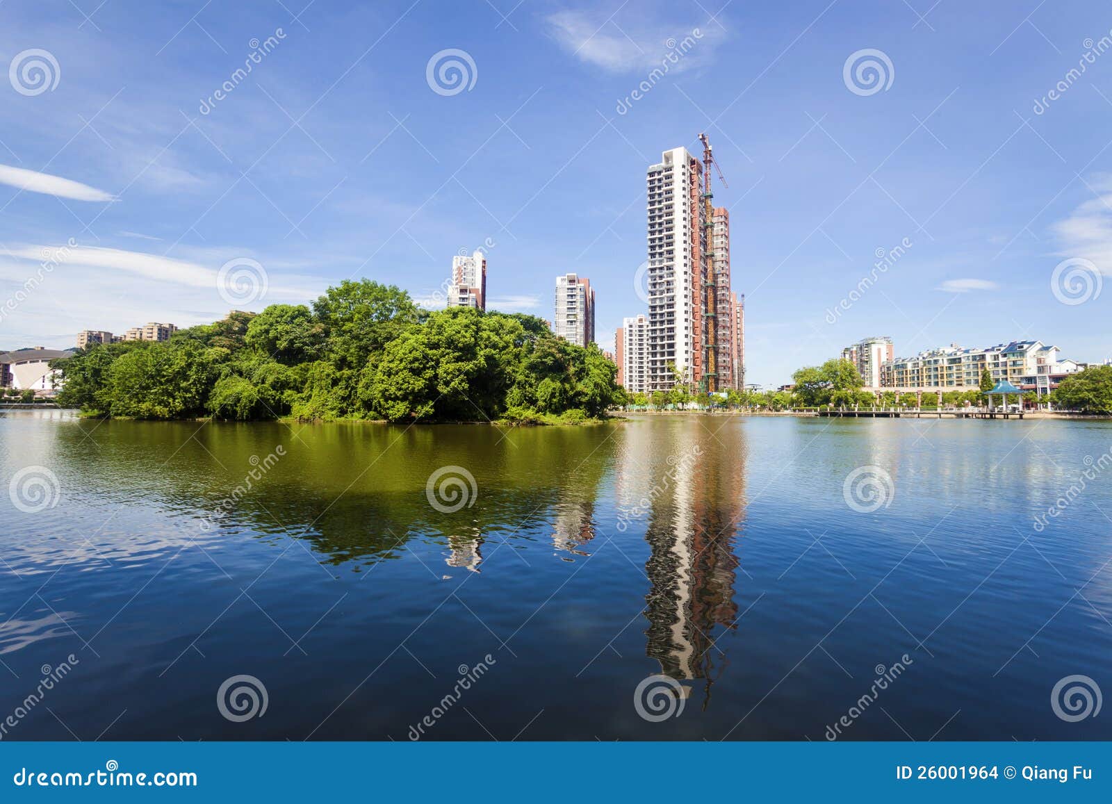 City building near a lake stock photo. Image of cloud - 26001964