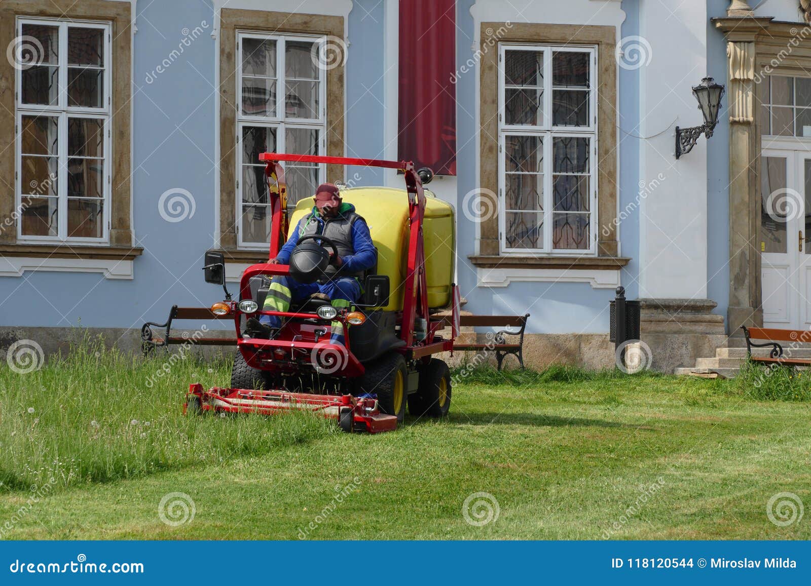 City grass mowing editorial stock image. Image of mover - 118120544