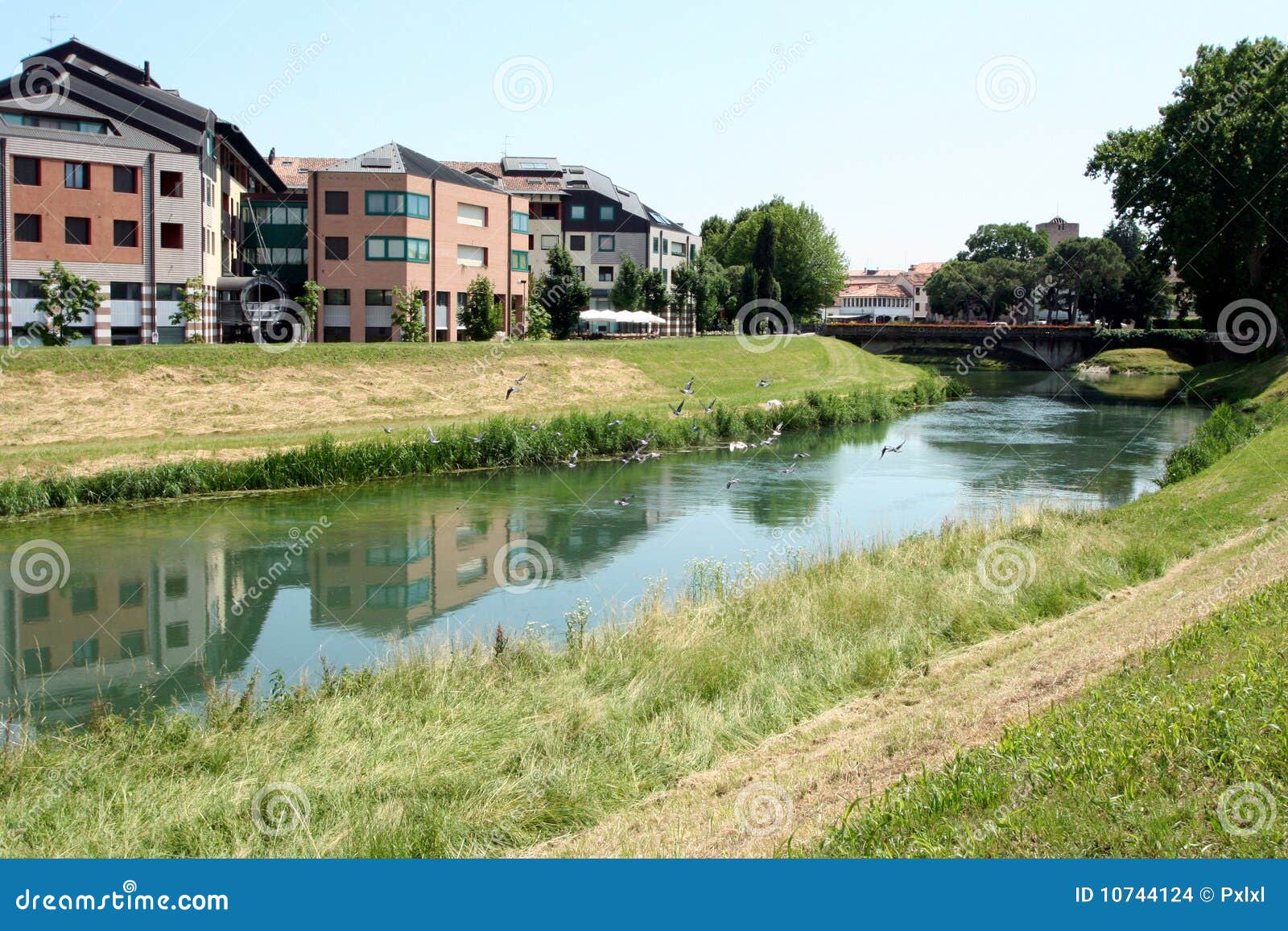 City Landscape Reflected on a River Stock Photo - Image of landscape ...