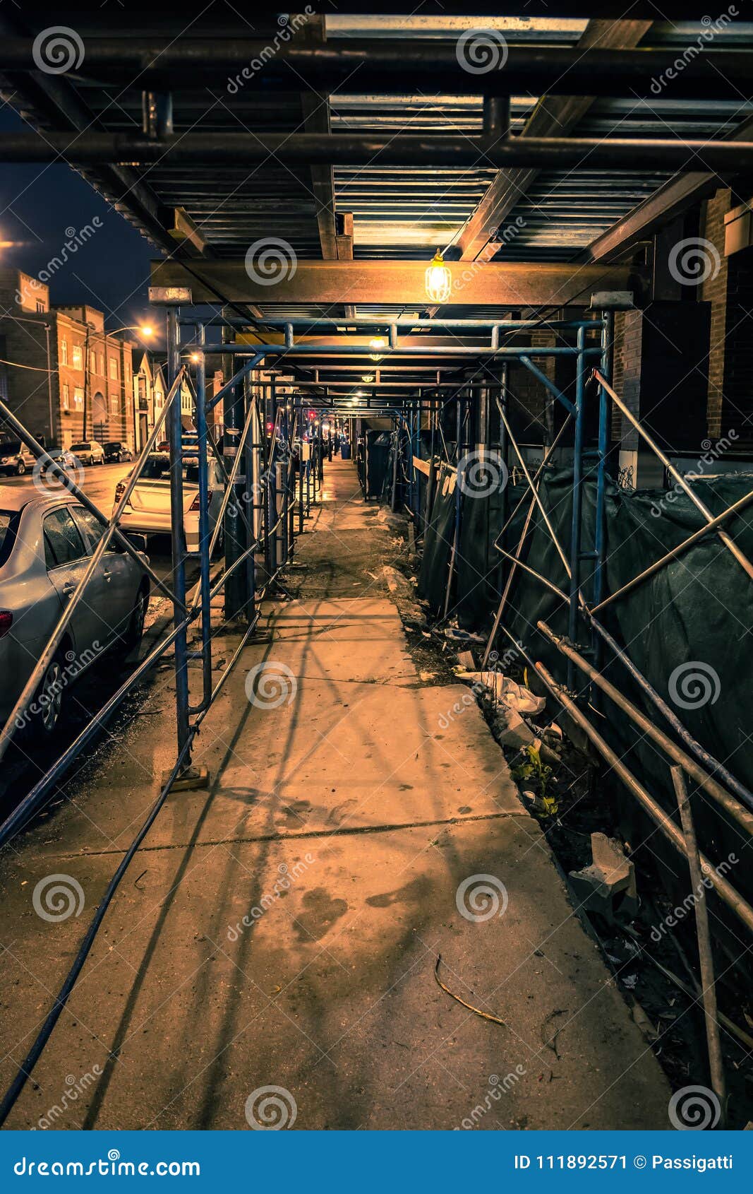 A City Sidewalk with Construction Scaffolding at Night Stock Image ...
