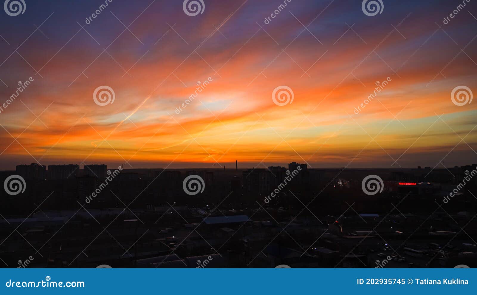 City is on a Sky Background with Orange and Yellow Sunset or Sunrise ...