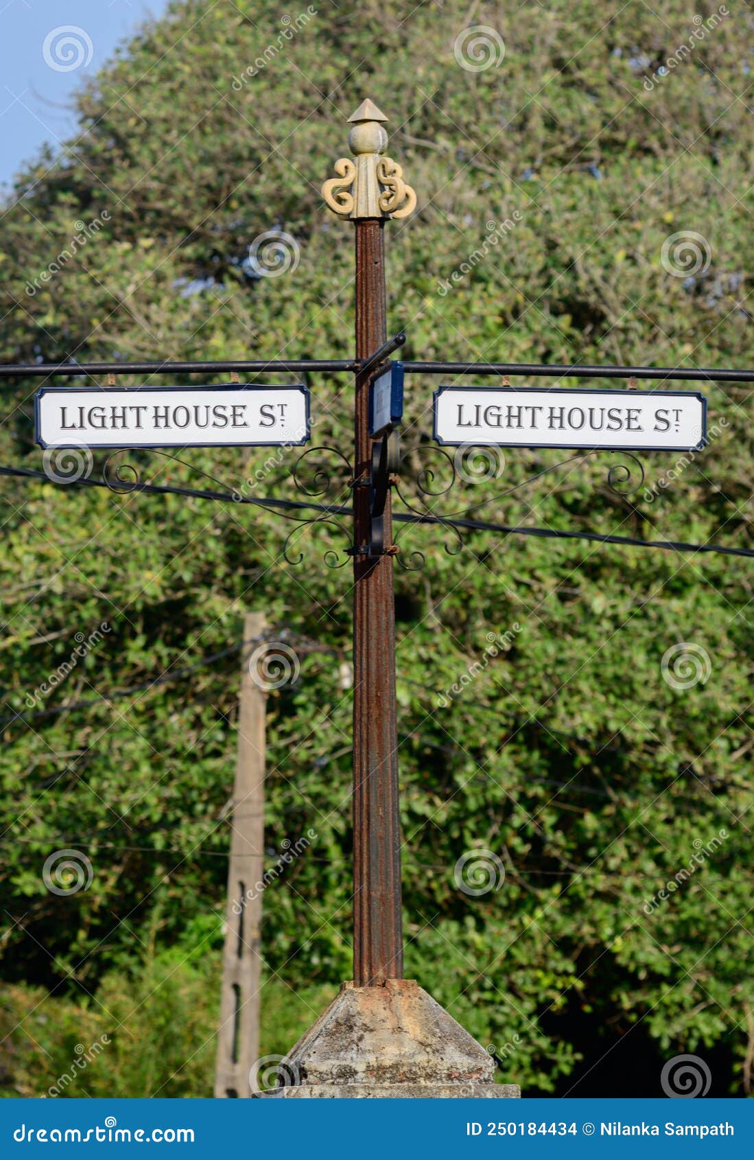 City Street Metal Guide Post in the Middle of a Junction Stock Photo ...