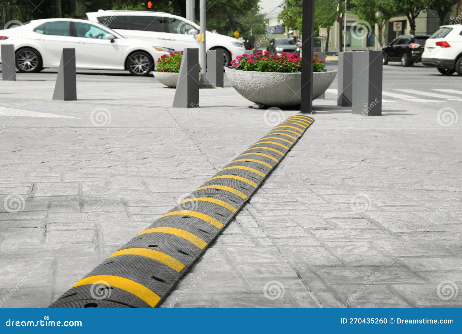 City Street with Striped Plastic Speed Bump Stock Photo - Image of ...