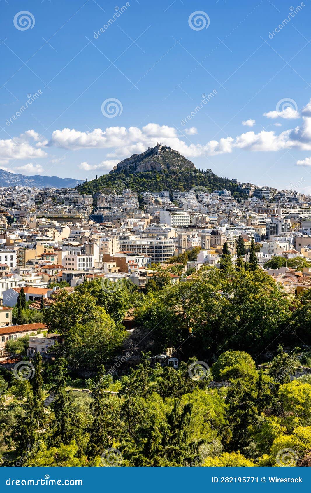 Cityscape of Athens Surrounded by Greenery Under a Blue Sky and ...
