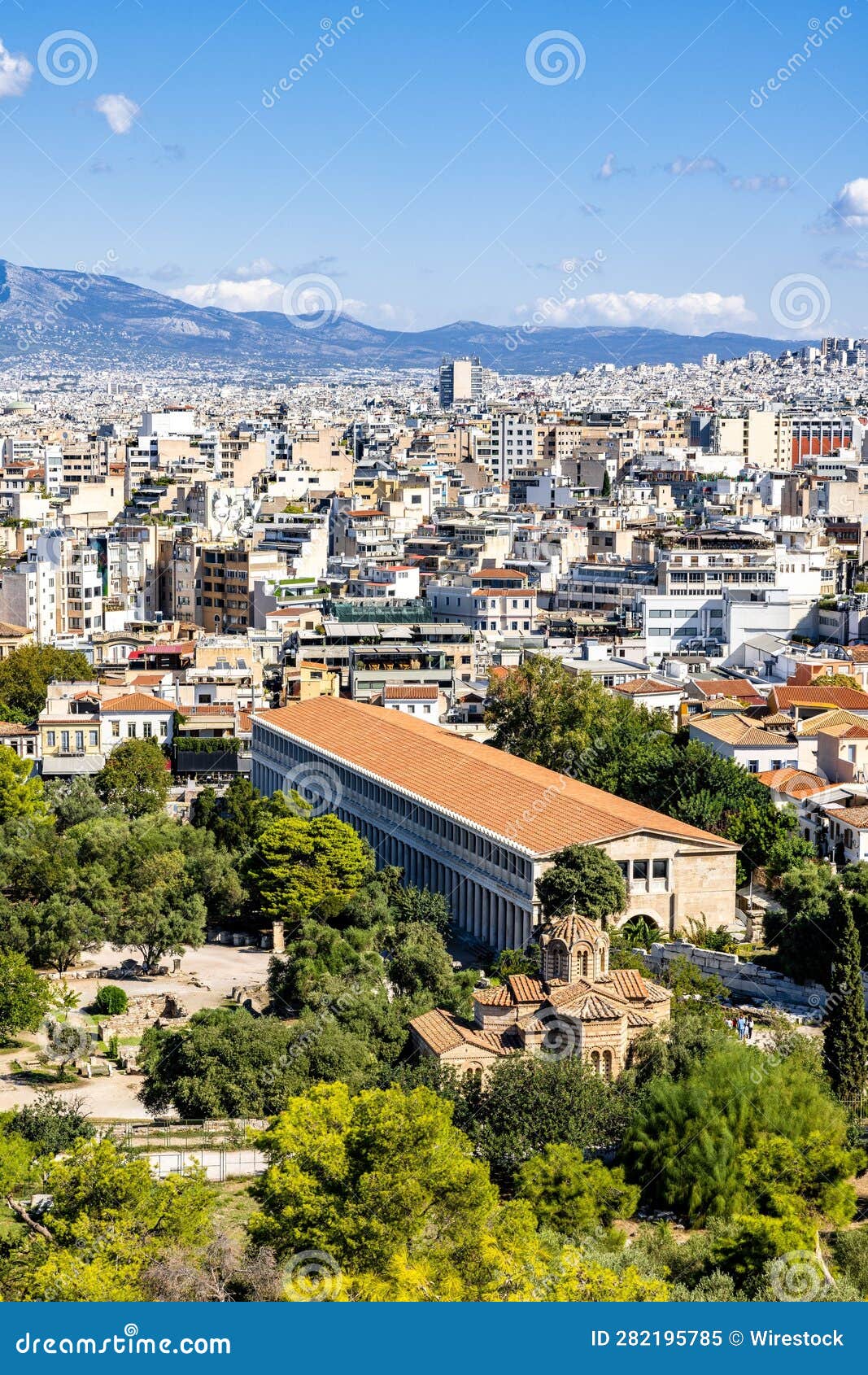 Cityscape of Athens Surrounded by Greenery Under a Blue Sky and ...