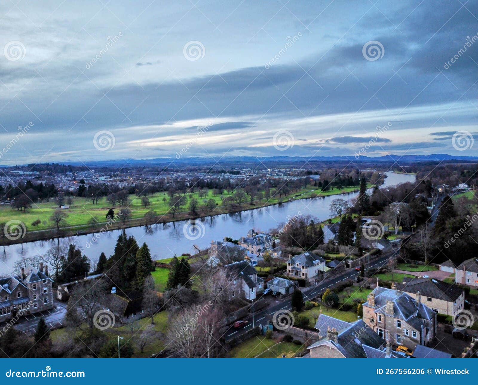 Cityscape on a River Shore during Sunset Stock Photo - Image of ...