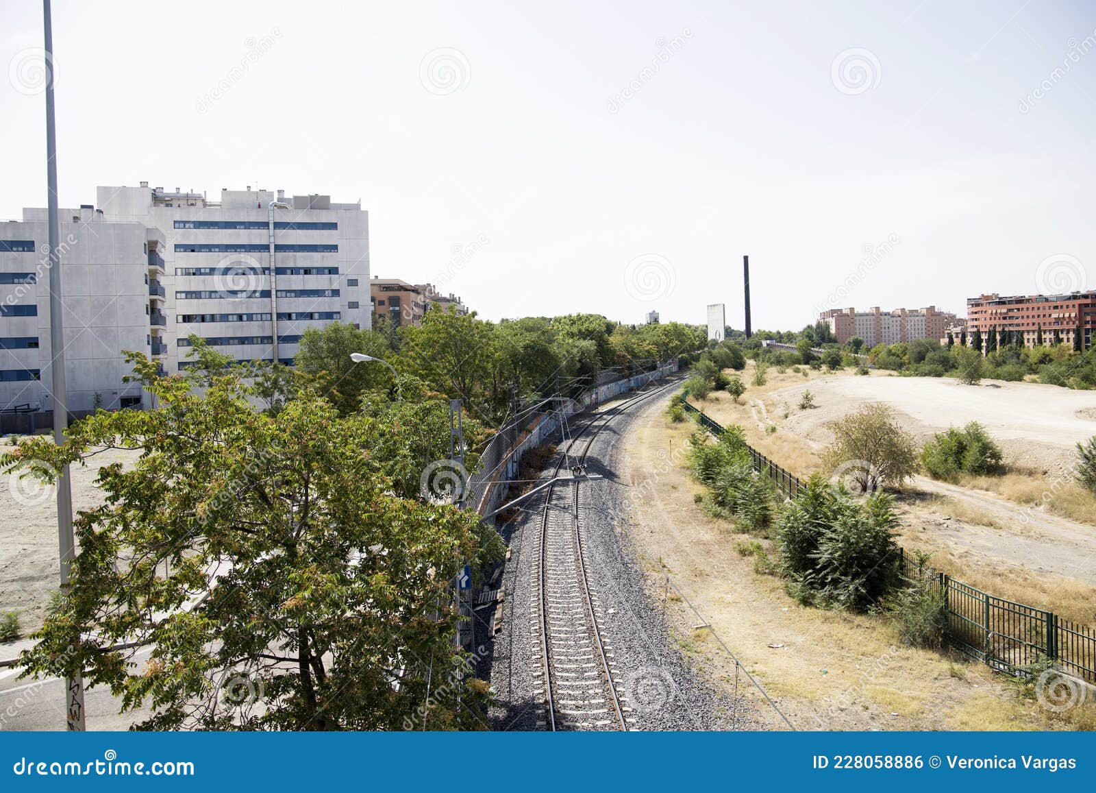 Cityscape with Train Tracks and Buildings in the Background Stock Photo ...