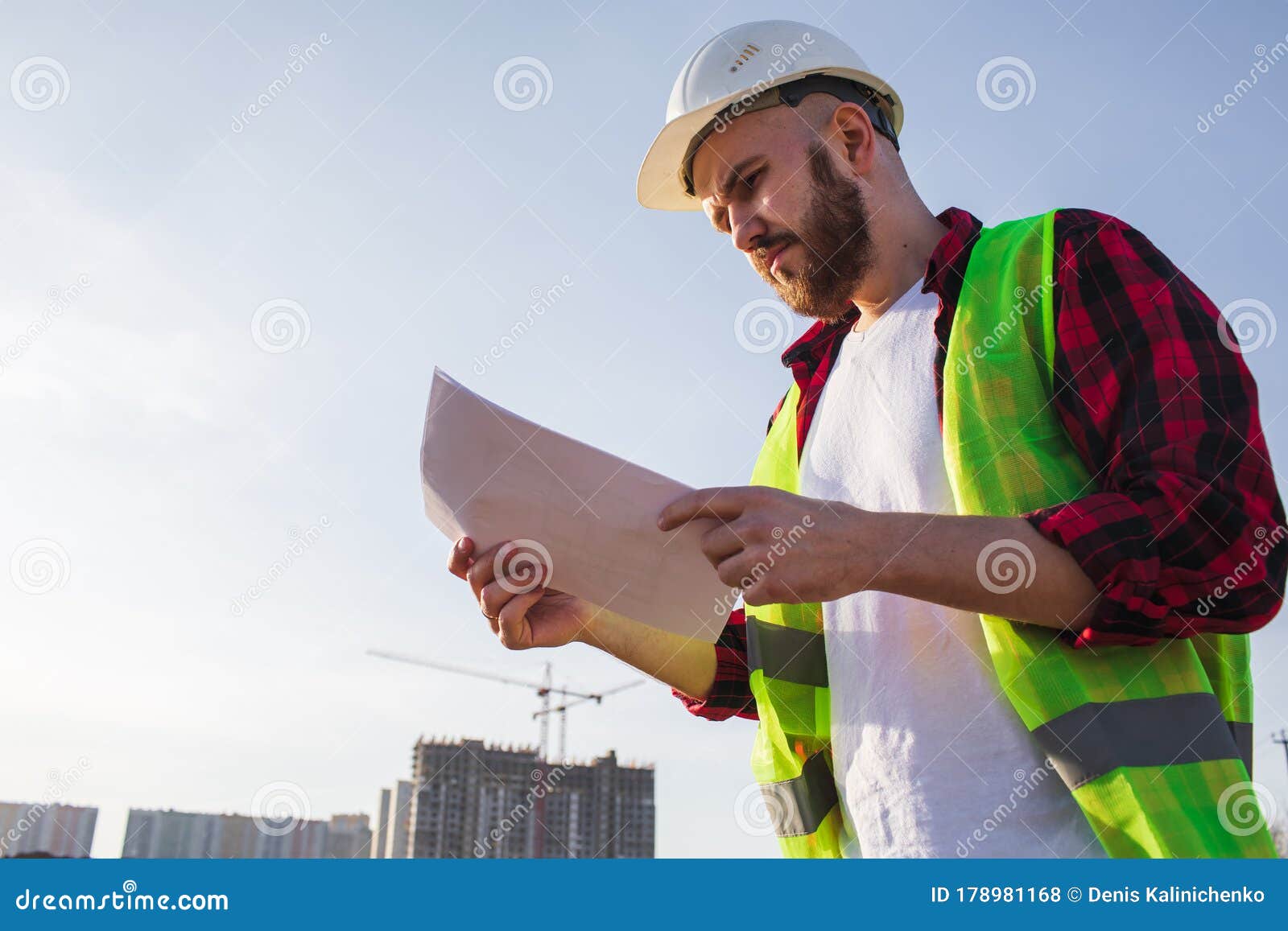 Civil Engineer Checking Work for Communication To Management Team in ...