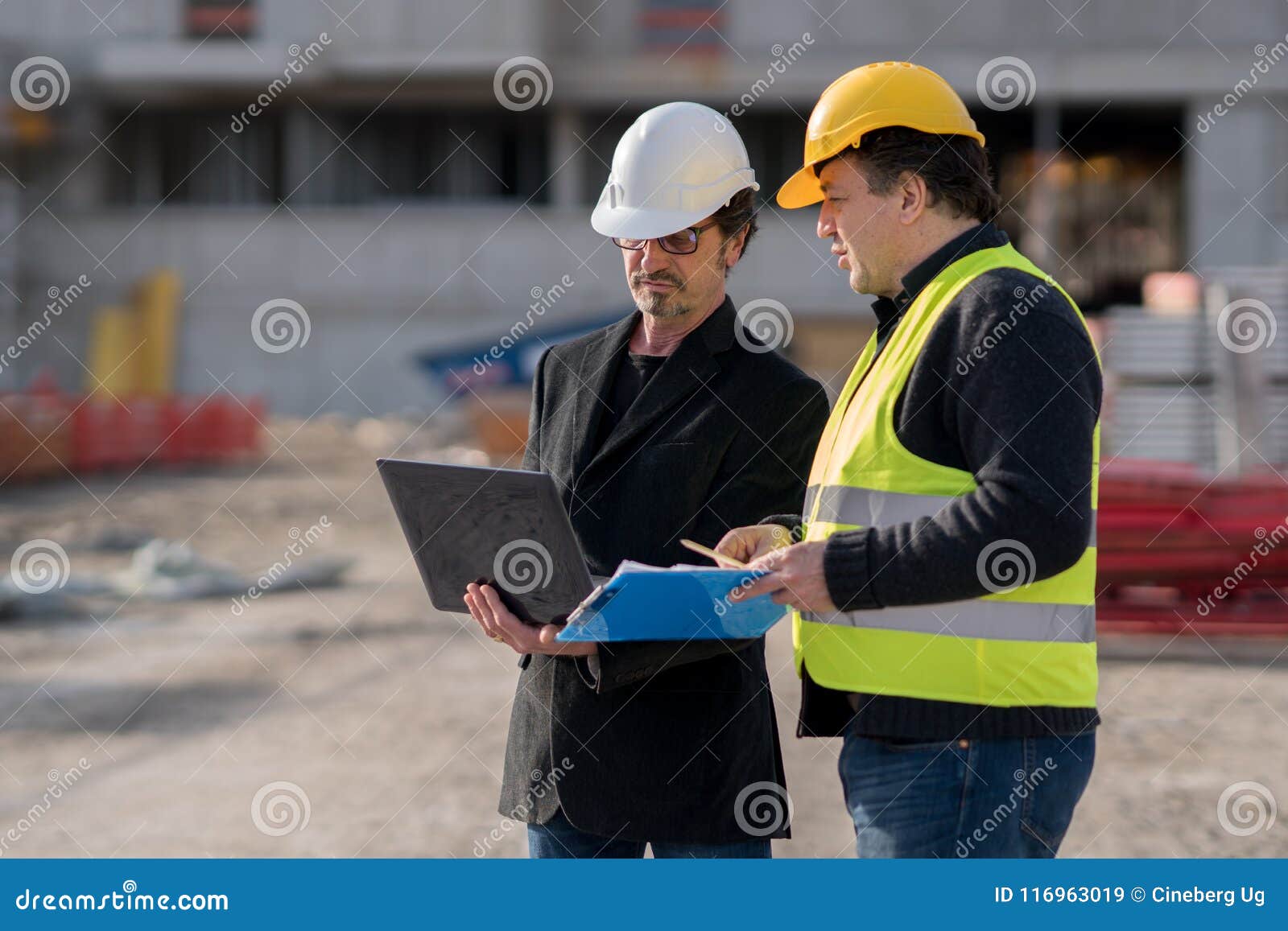 Foreman at Work with One of the Construction Workers Stock Image ...