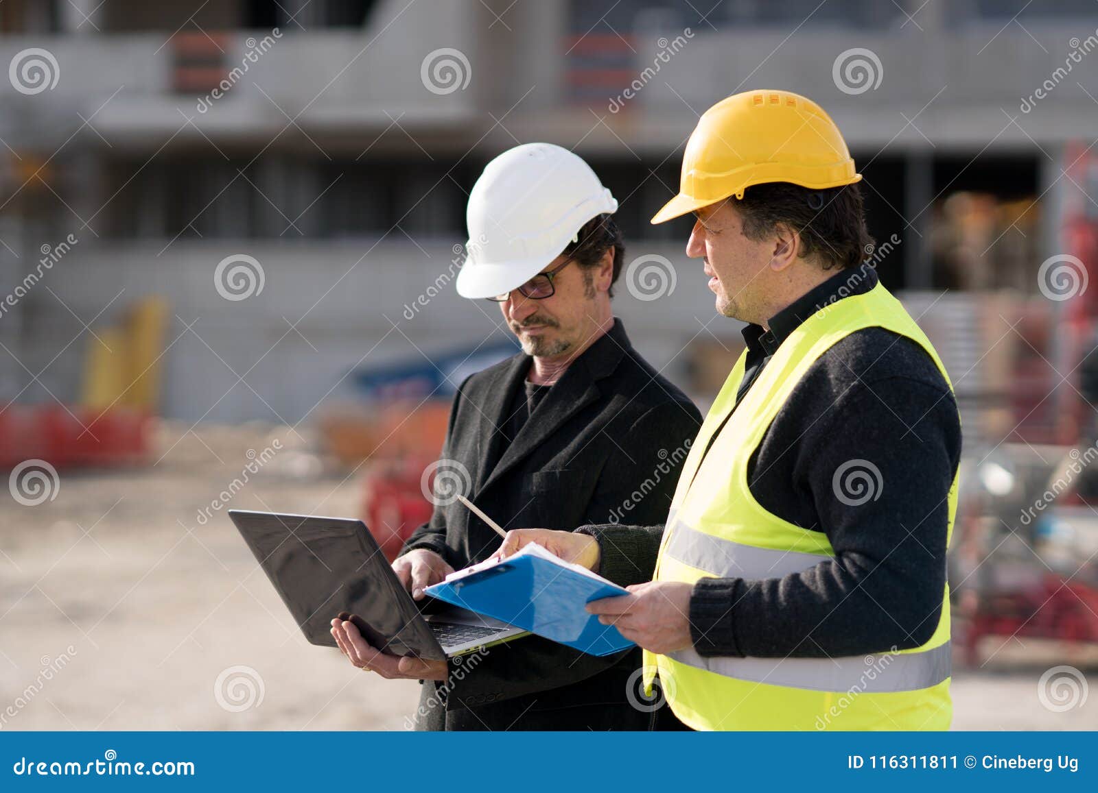 Construction Manager and Engineer at Work on Construction Site Stock ...