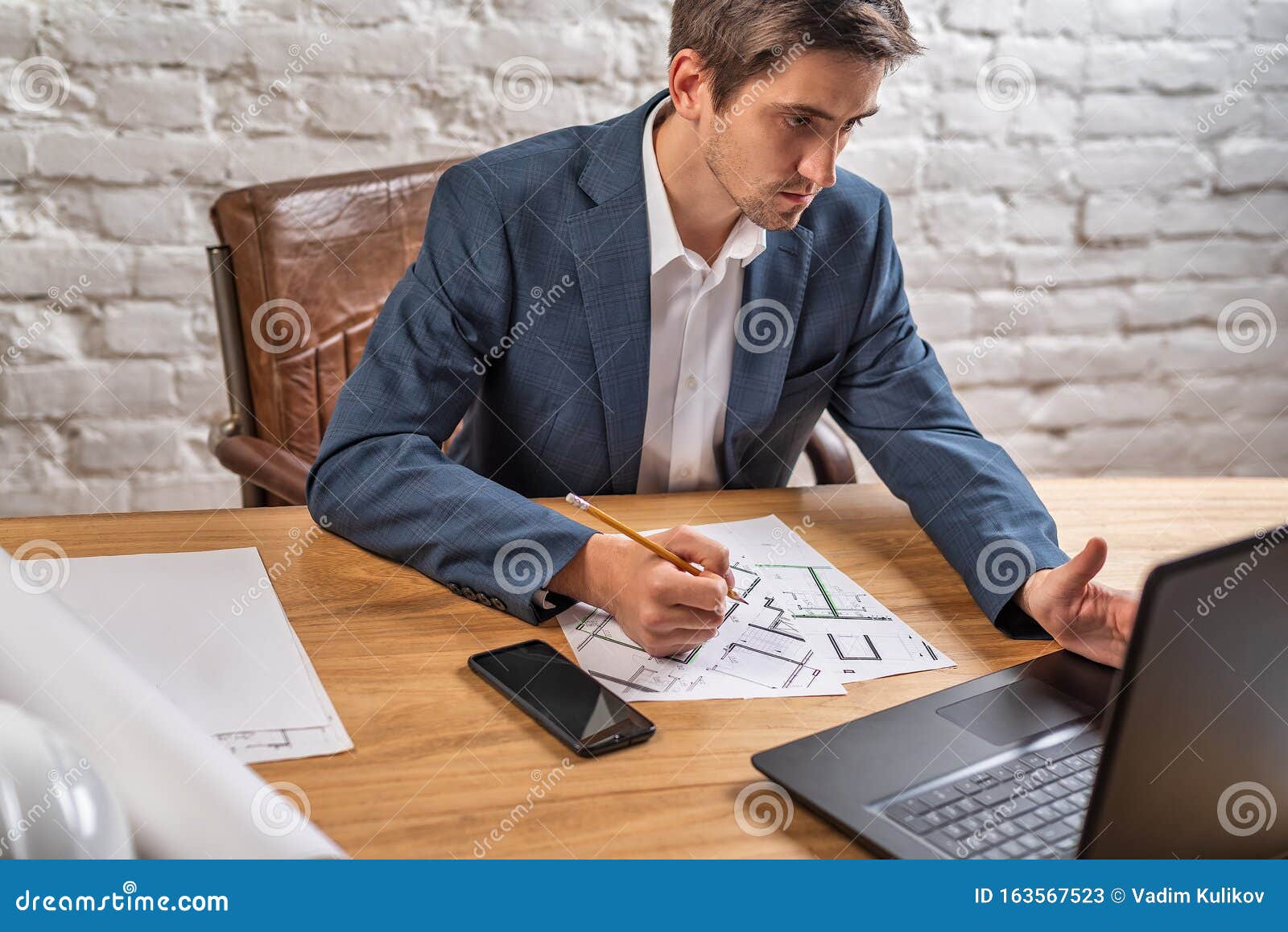 Civil Engineer at His Desk Working with Documents Stock Image - Image ...