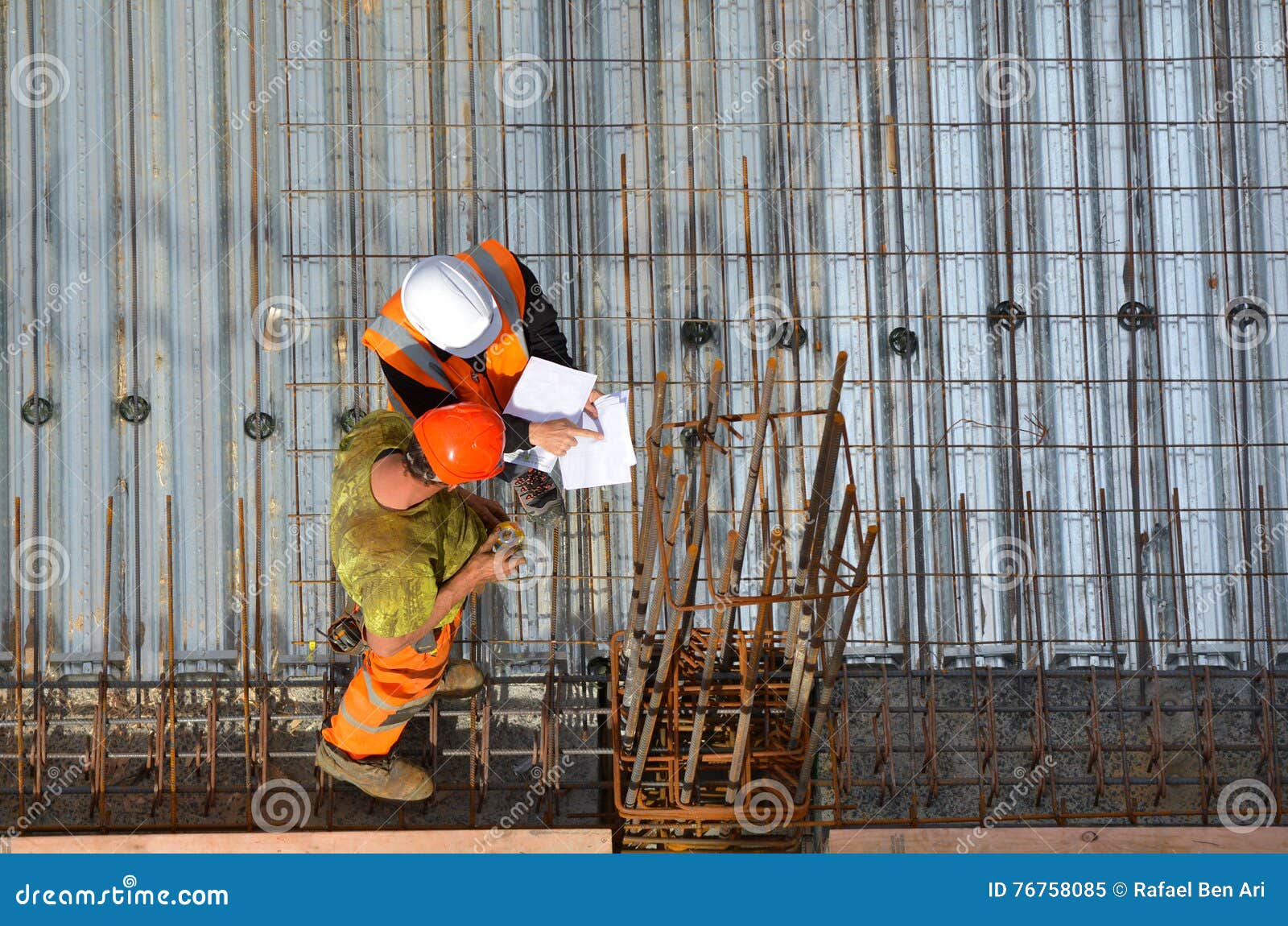 Civil Engineer Inspecting the Work Progress of a Worker in a Con Stock ...
