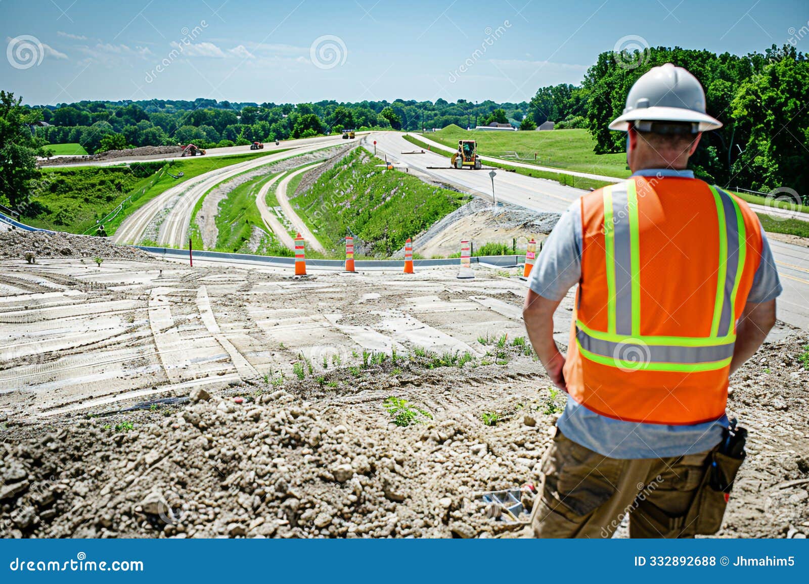 Civil Engineer Overseeing Earthwork and Paving on an Overpass ...