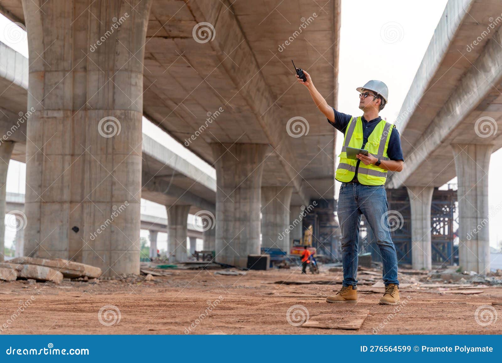 A Civil Engineer Standing Pointing at a Road or Expressway Construction ...