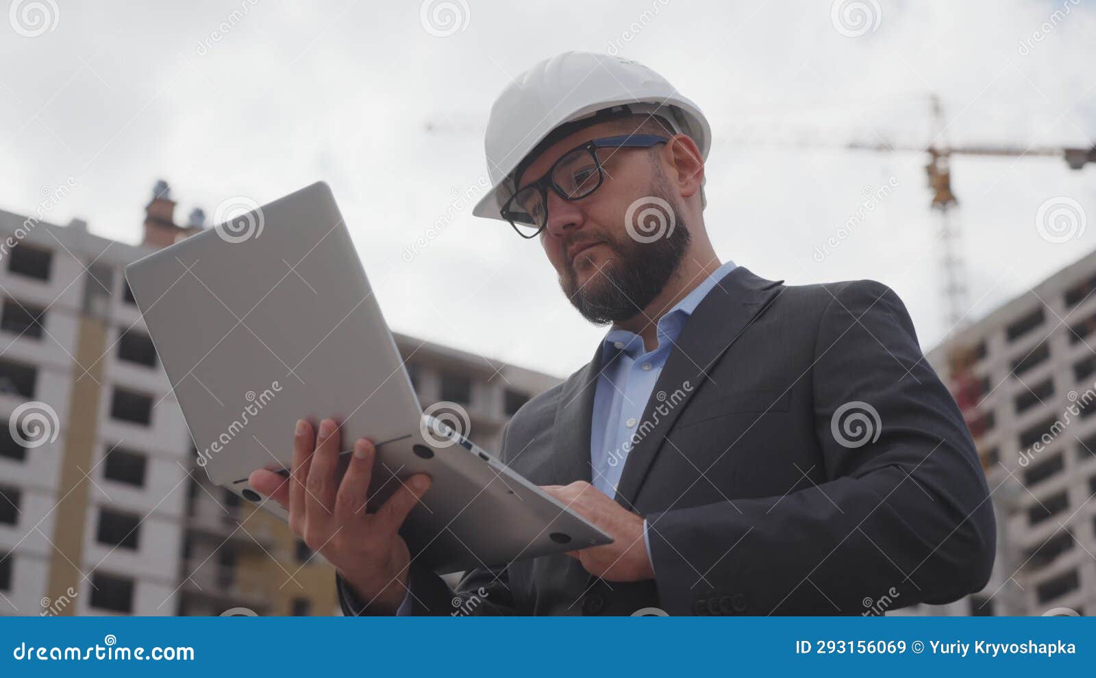 Civil Engineer in Suit and Protective Helmet Making Important Notes in ...