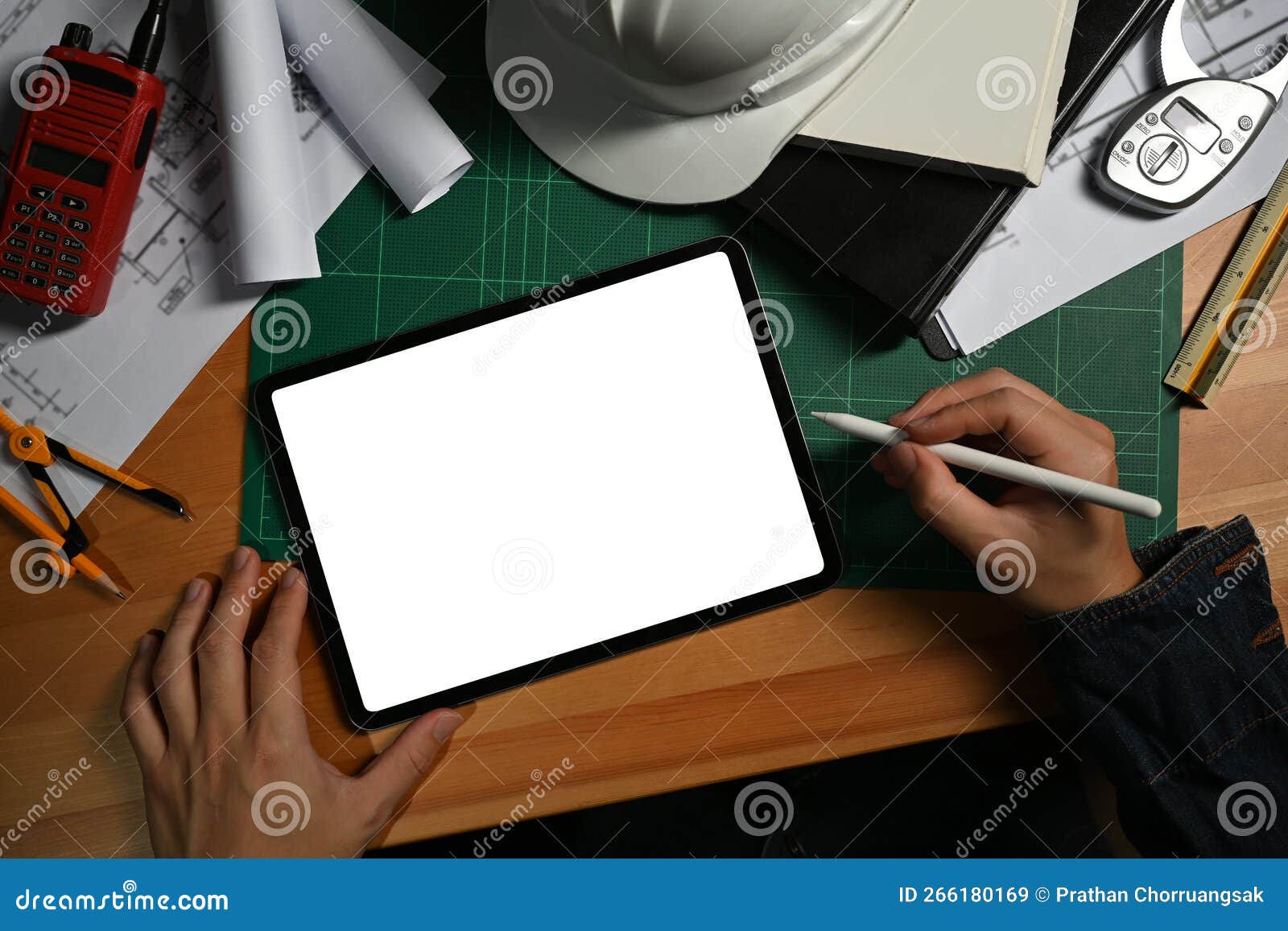Civil Engineer Using Digital Tablet and Working with Blueprints at ...
