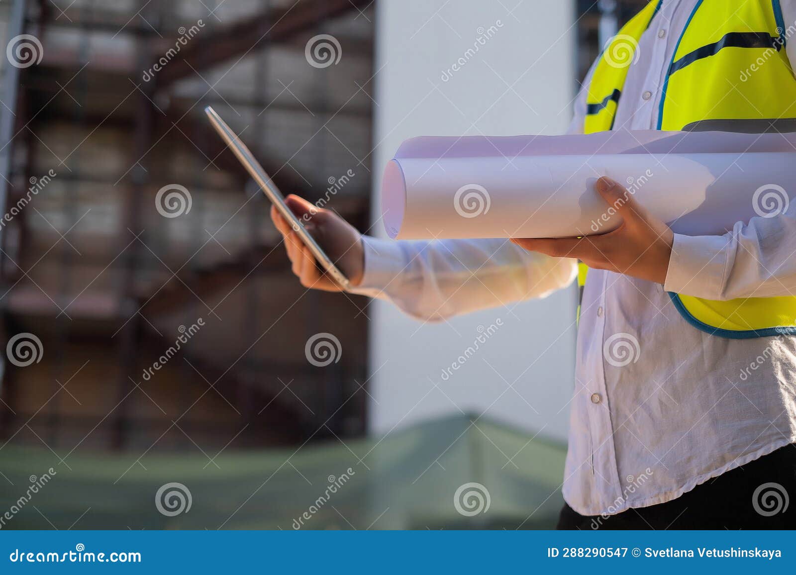 Civil Engineer Using a Tablet, Planning a Project, Builds a Modern ...