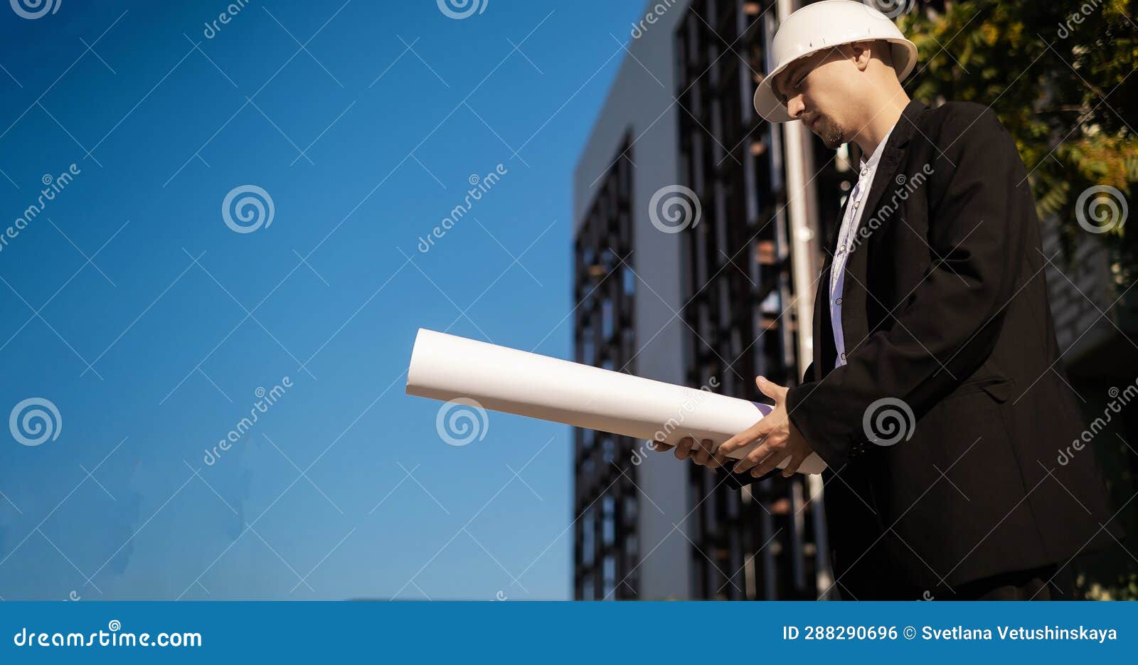 Civil Engineer Using a Tablet, Planning a Project, Builds a Modern ...