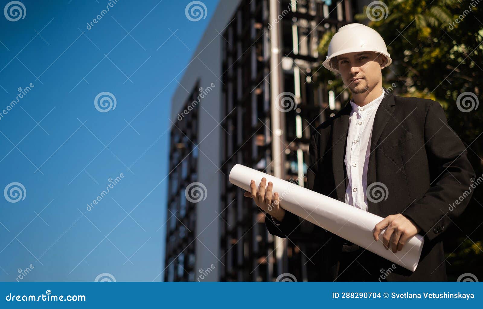 Civil Engineer Using a Tablet, Planning a Project, Builds a Modern ...