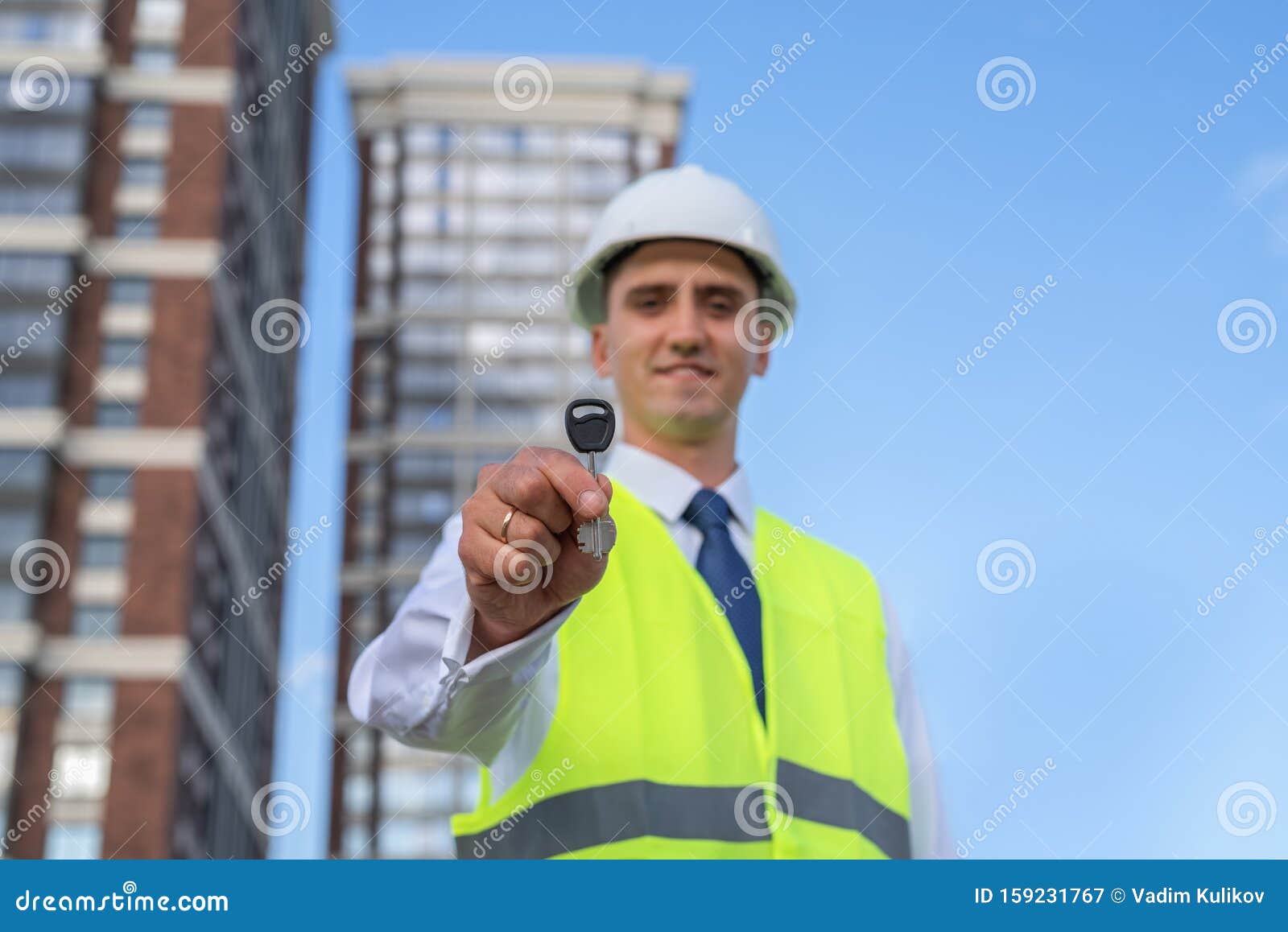 Civil Engineer in a White Helmet on the Background of Construction ...