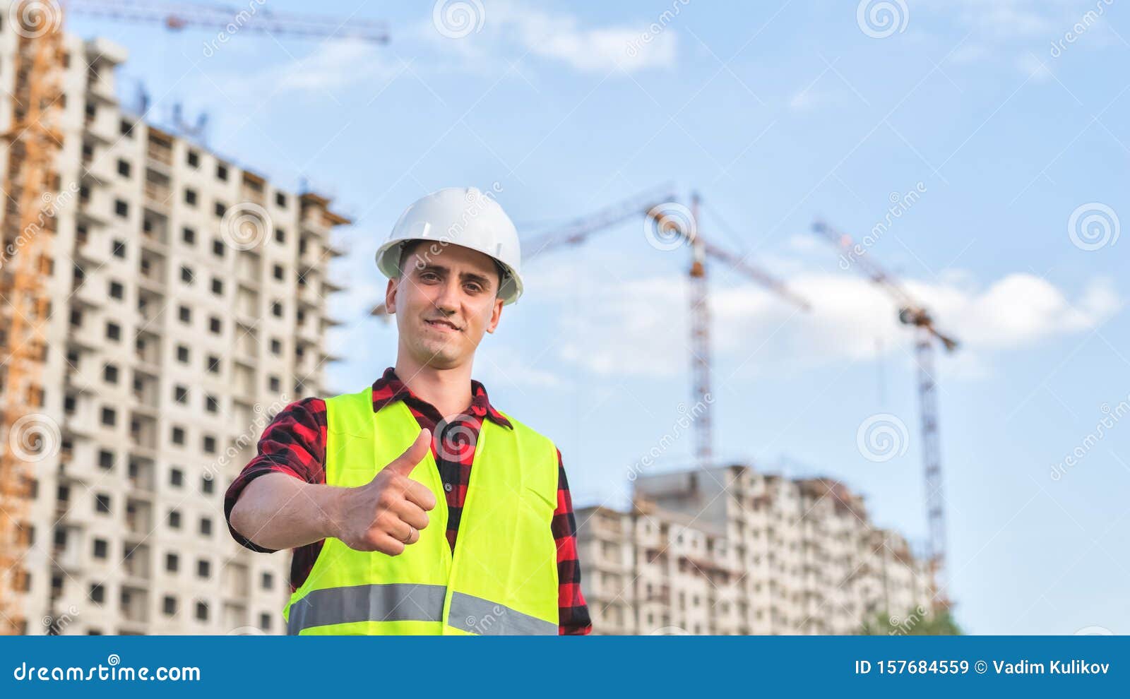 Civil Engineer in a White Helmet on the Background of Construction ...