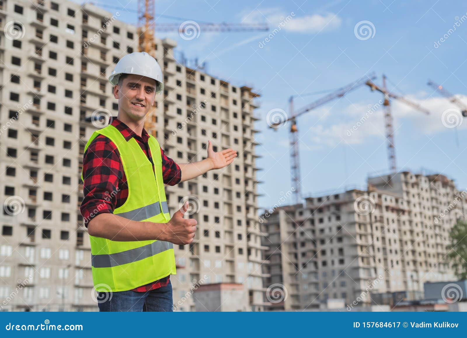 Civil Engineer in a White Helmet on the Background of Construction ...