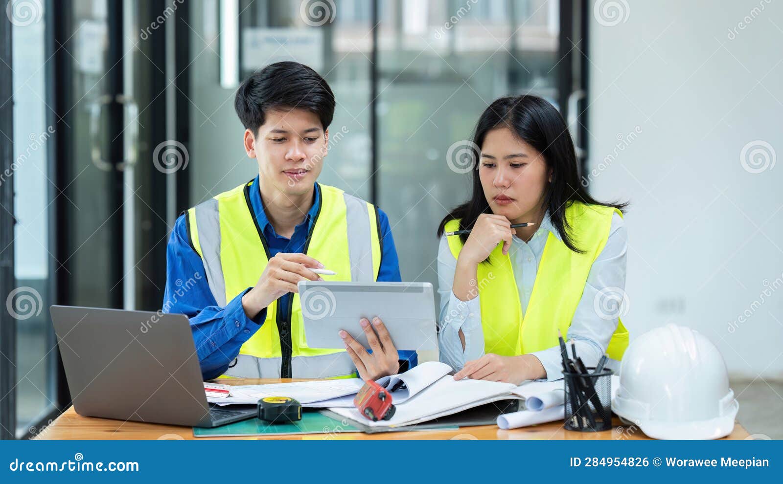 Civil Engineers and Architects Discuss Project Construction Together at ...