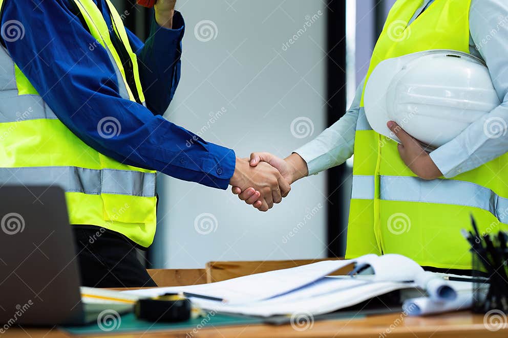 Civil Engineers and Architects Handshake after Work Done at the Office ...