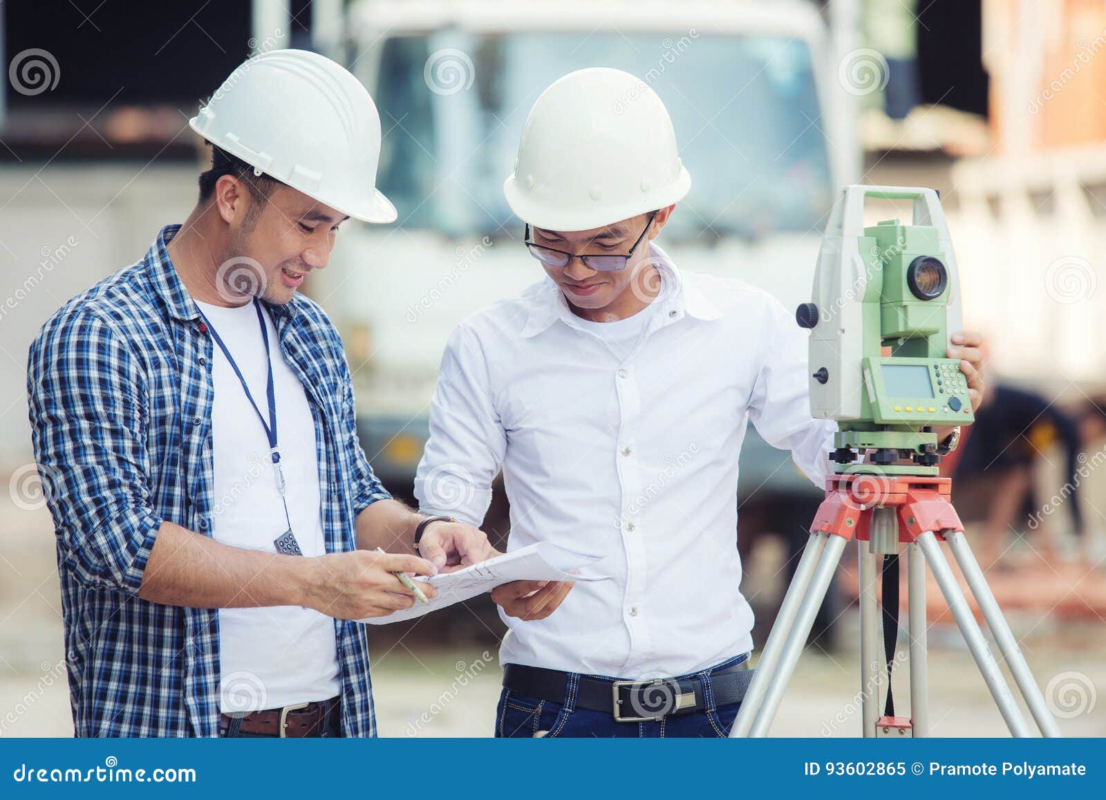 Civil Engineers at Construction Site and a Land Surveyor Using a Stock ...