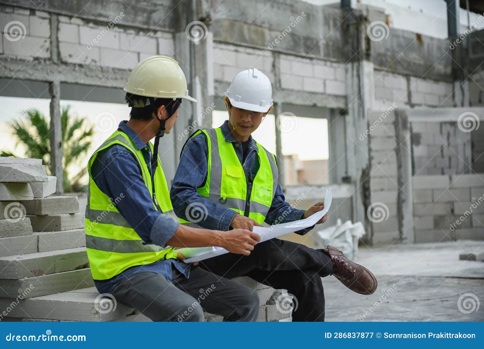 Civil Engineers Discuss with Foreman or Builder while Opening ...
