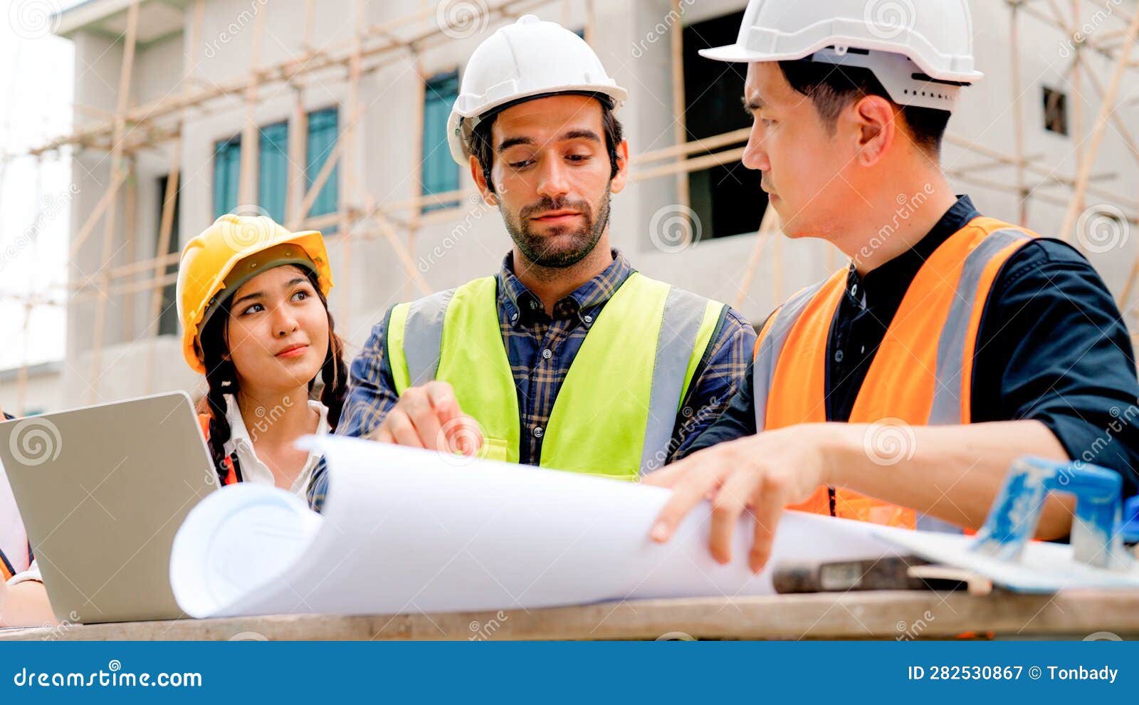 Civil Engineers Team with Safety Hard Hat Working Together at ...