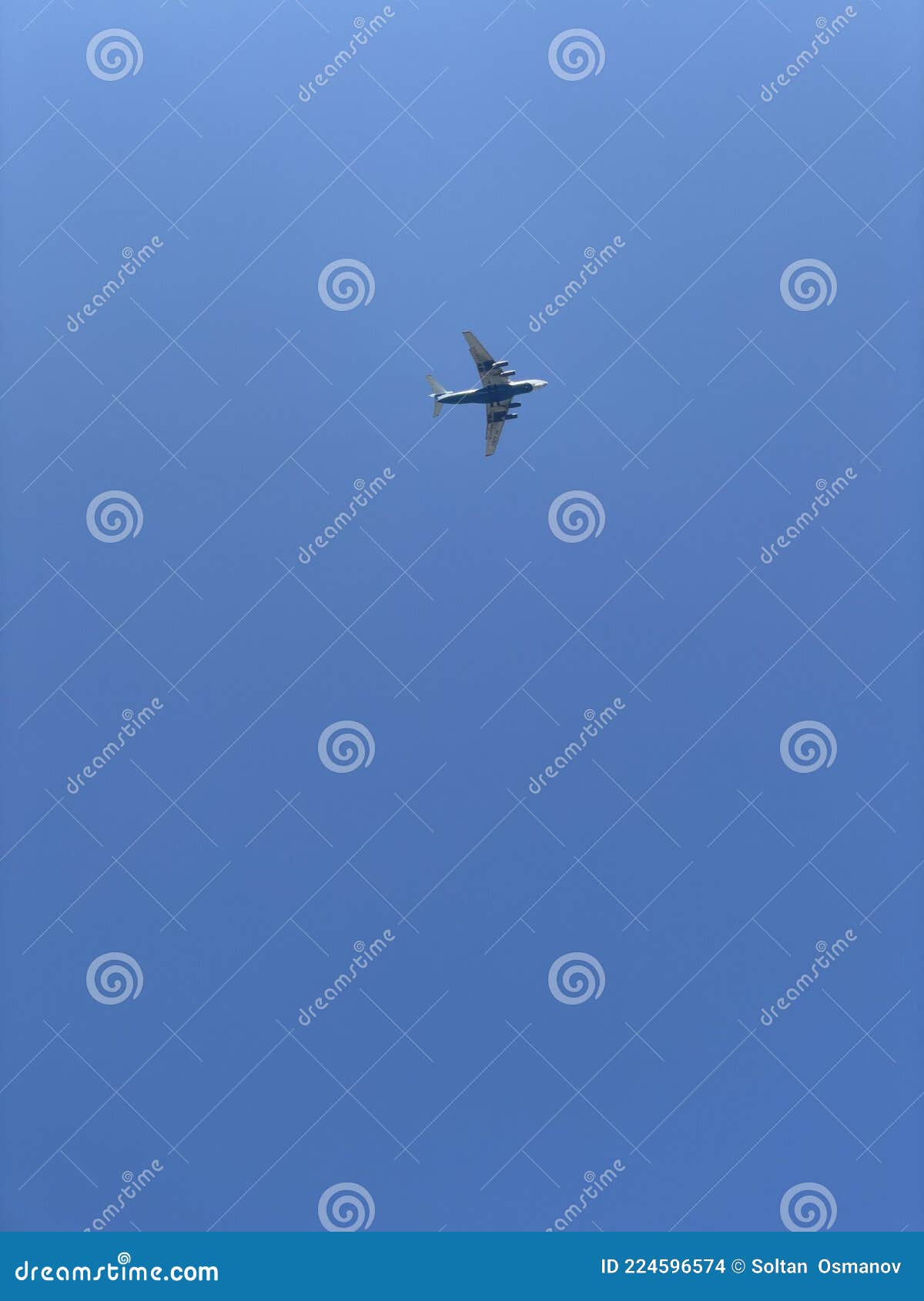 A Civilian Plane in the Blue Sky. Bottom View Stock Photo - Image of ...