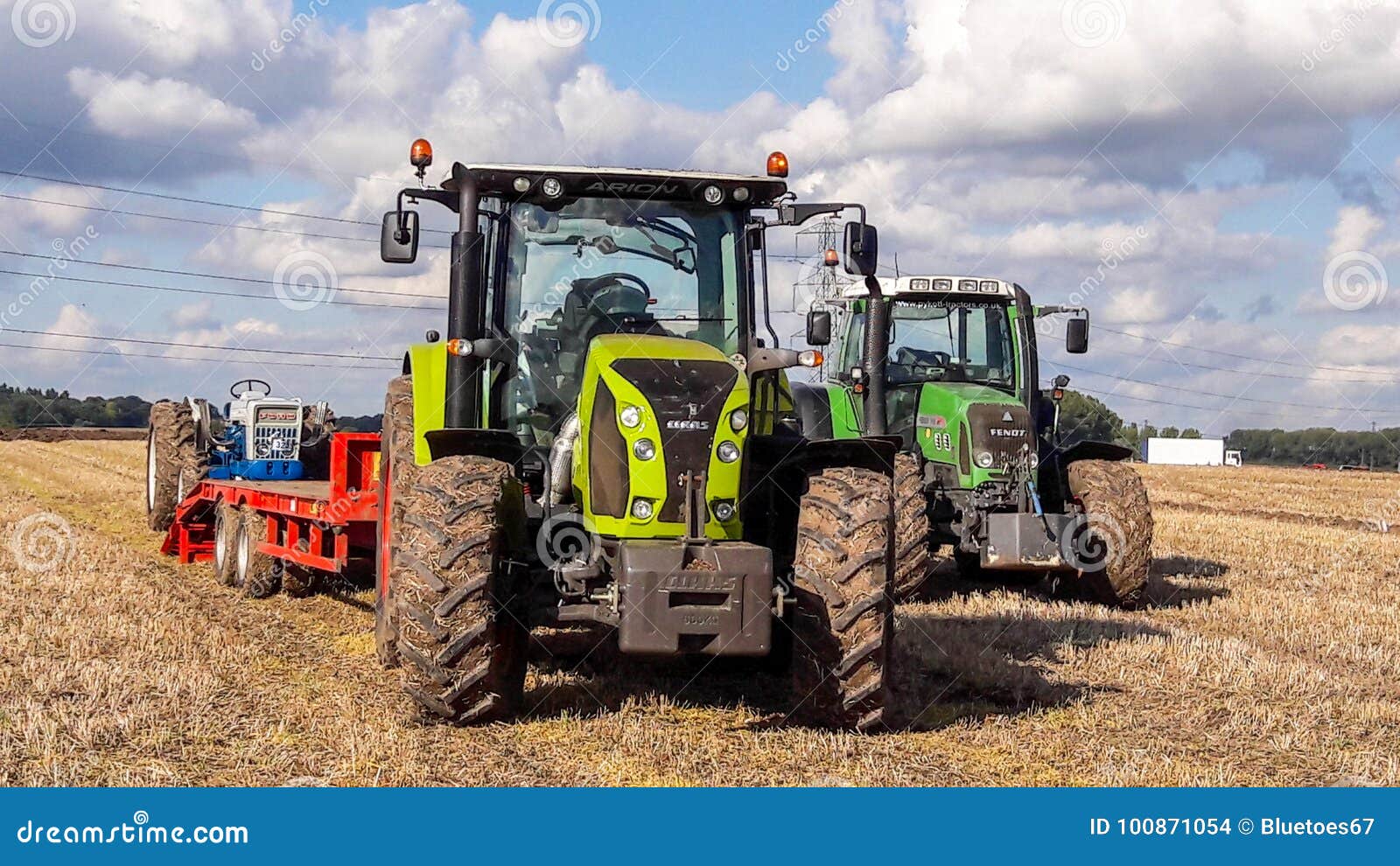A Claas 630 Tractor Pulling a Trailer To Load Vintage Tractor Editorial ...