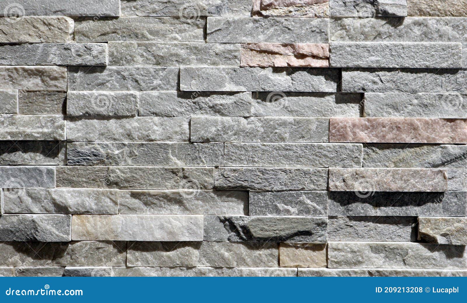 Cladding Wall Made of Small Uneven Stone Bricks, Predominantly Gray ...