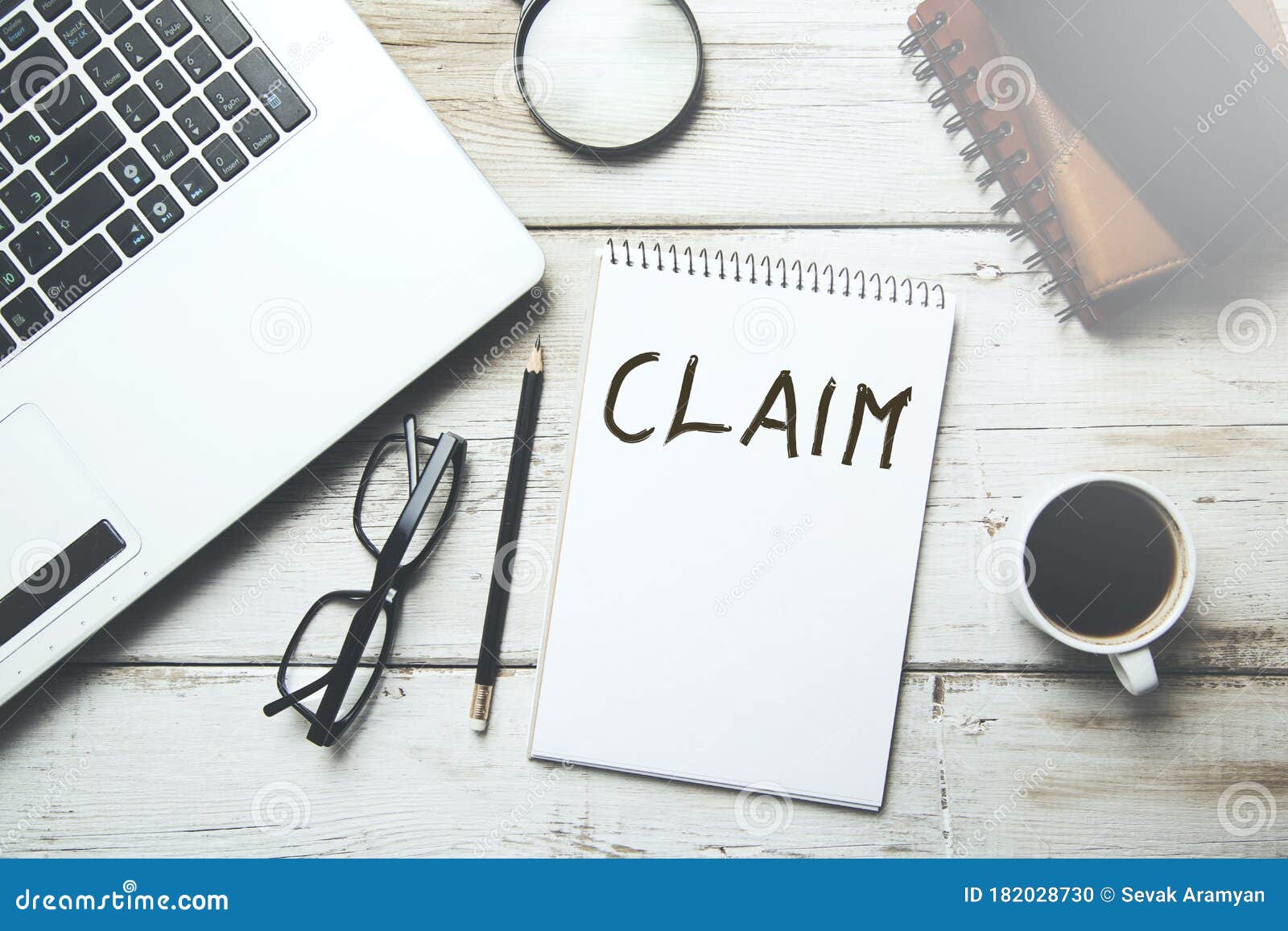 Claim Text on Notepad with Computer on Table Stock Photo - Image of ...
