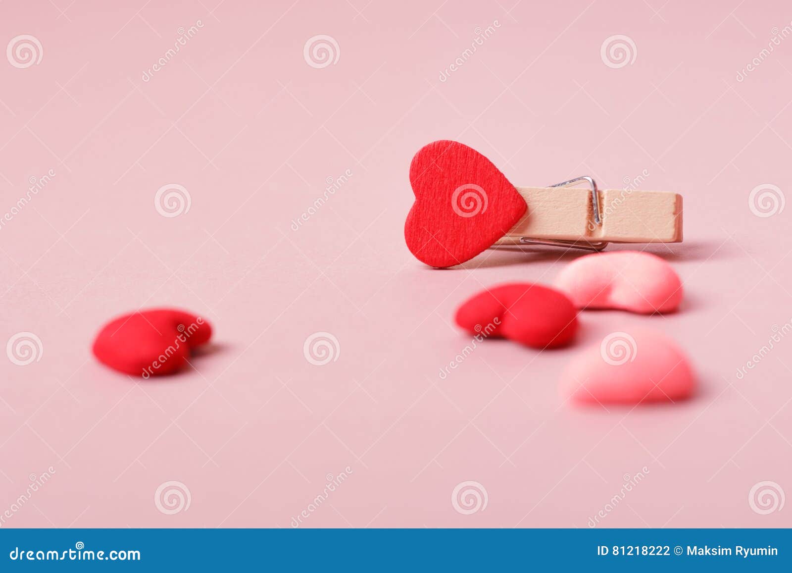 Clamp and Small Hearts on Light Pink Background. Stock Photo - Image of ...