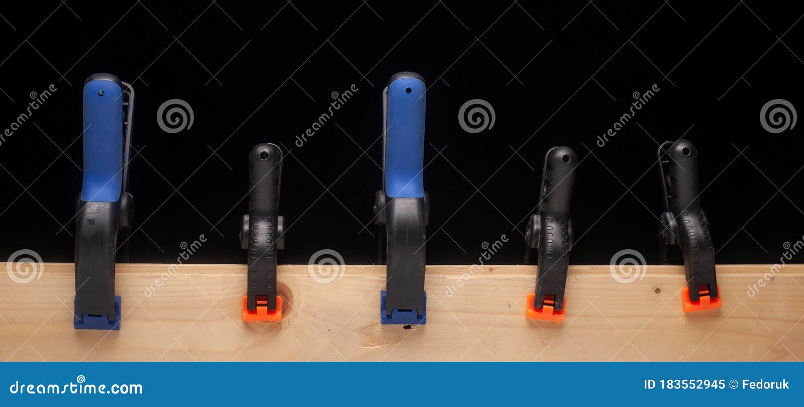 The Clamps on the Tree Stand in a Row . Stock Image - Image of work ...