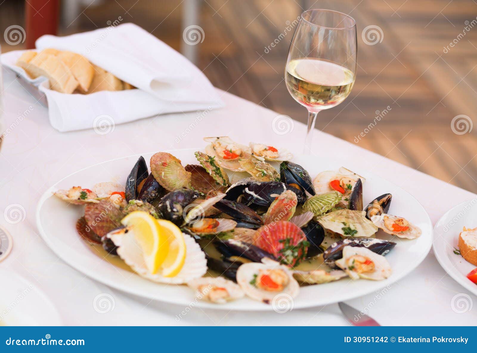 Clams and Glass of White Wine Stock Photo - Image of served, shell ...