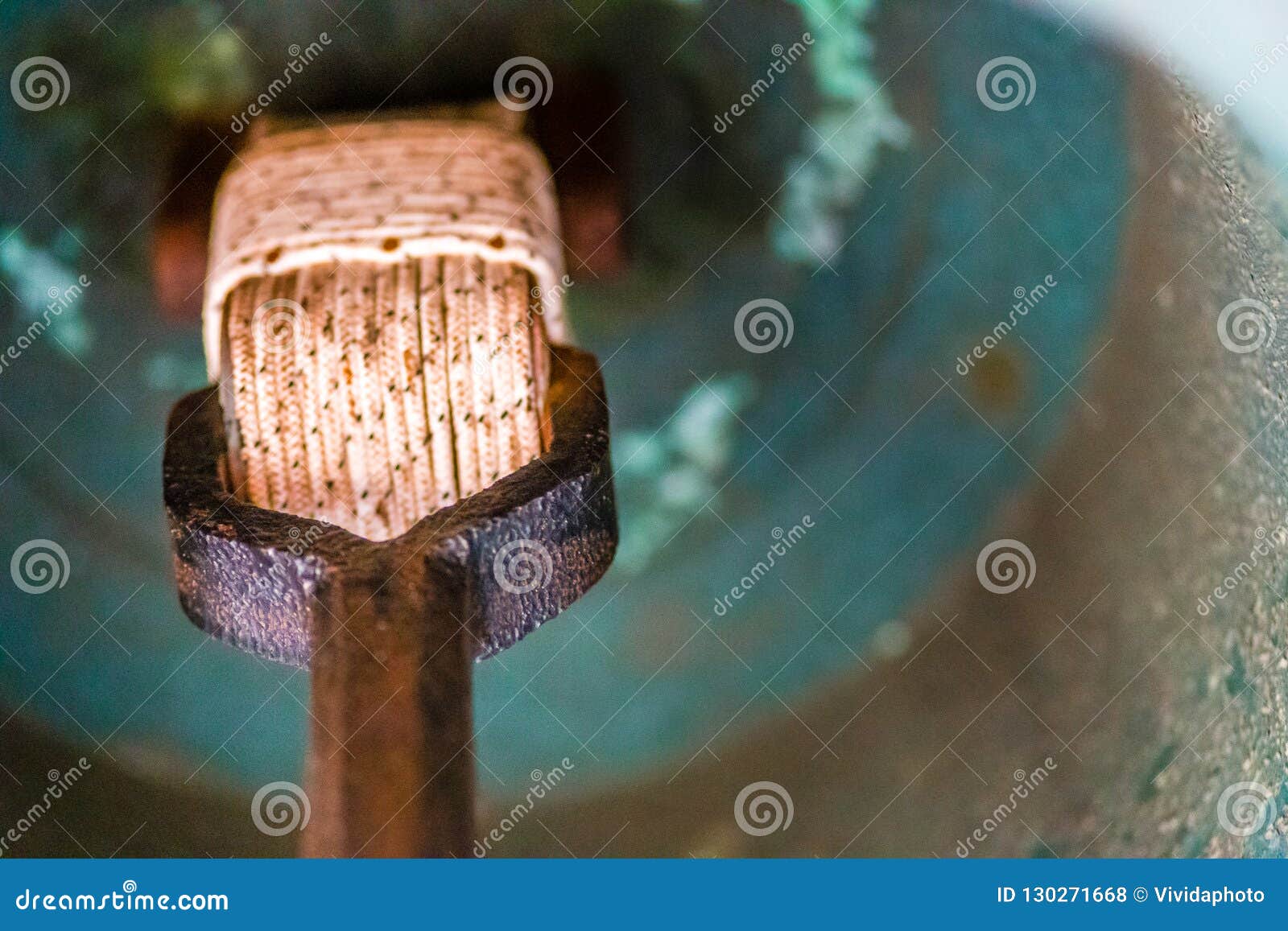 Clapper of ancient bell stock photo. Image of cathedral - 130271668