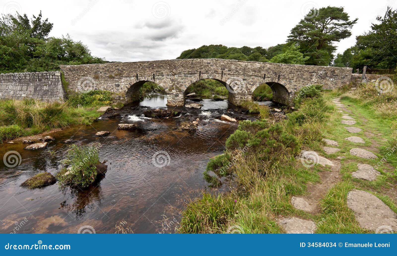 The Historic Clapper Bridge Made Out Of Granite And Crossing The East ...