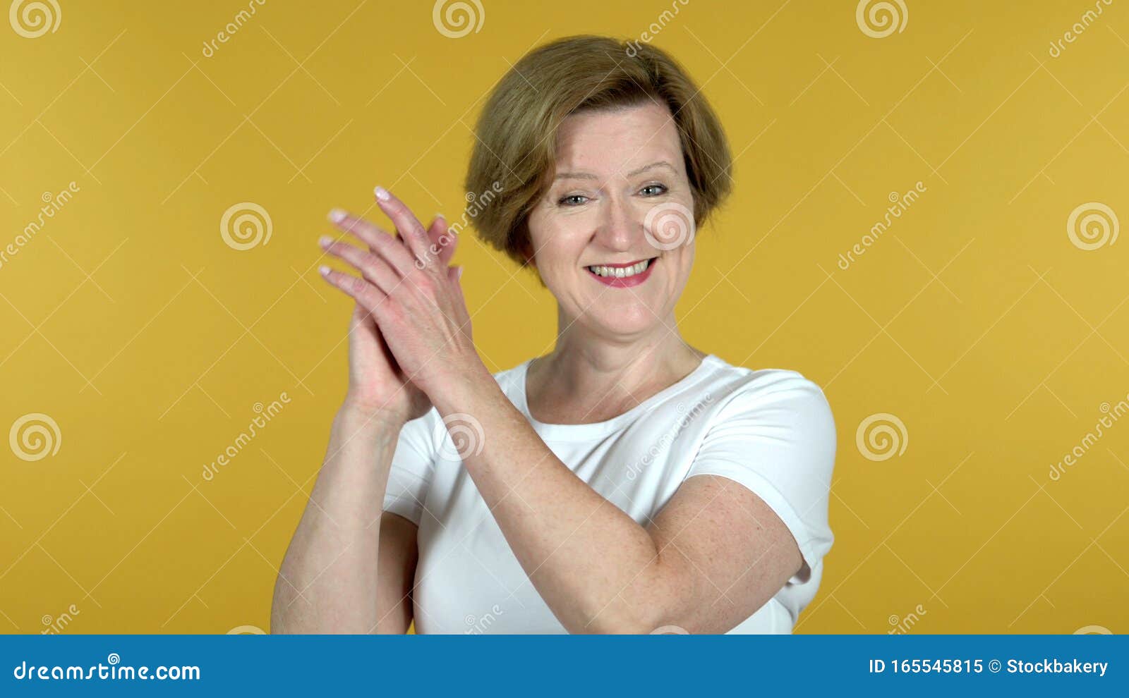 The Clapping Old Woman, Applauding Isolated on Yellow Background Stock ...