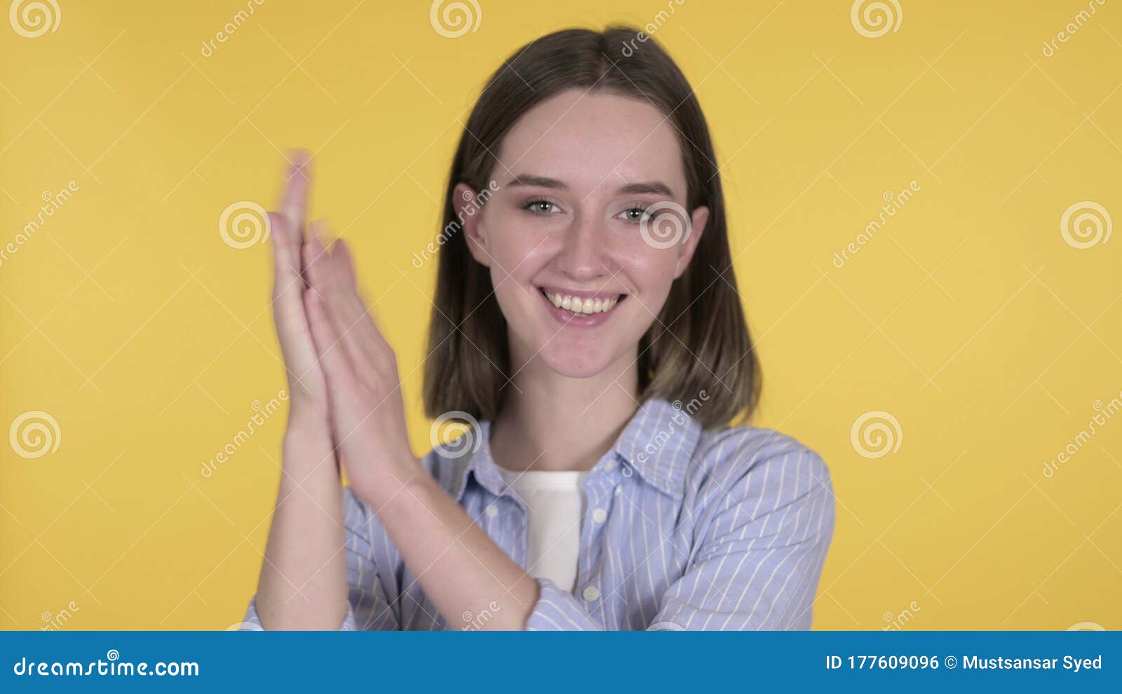 Clapping Young Woman Applauding on Yellow Background Stock Photo ...